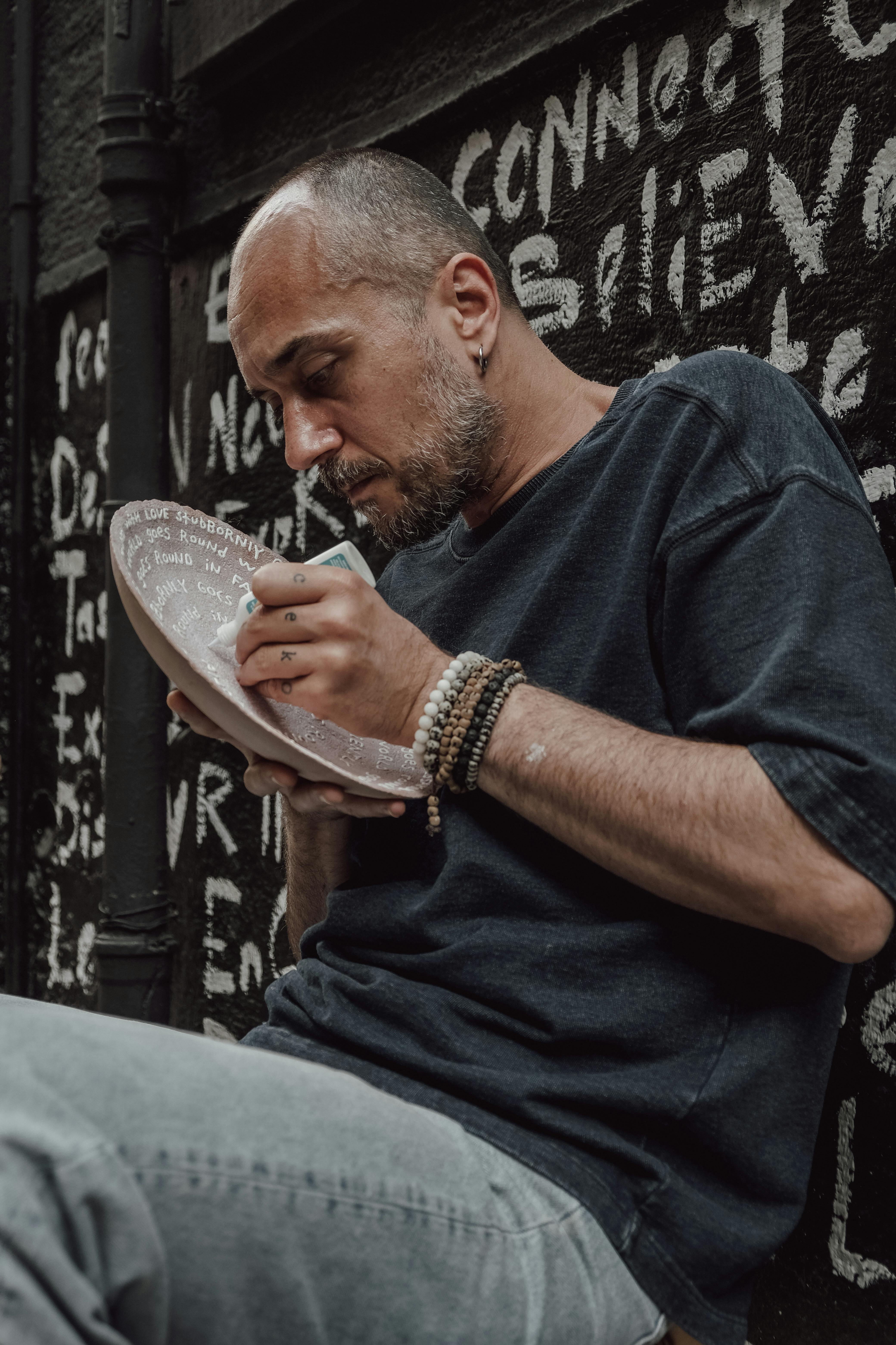 Man Decorating Plate · Free Stock Photo