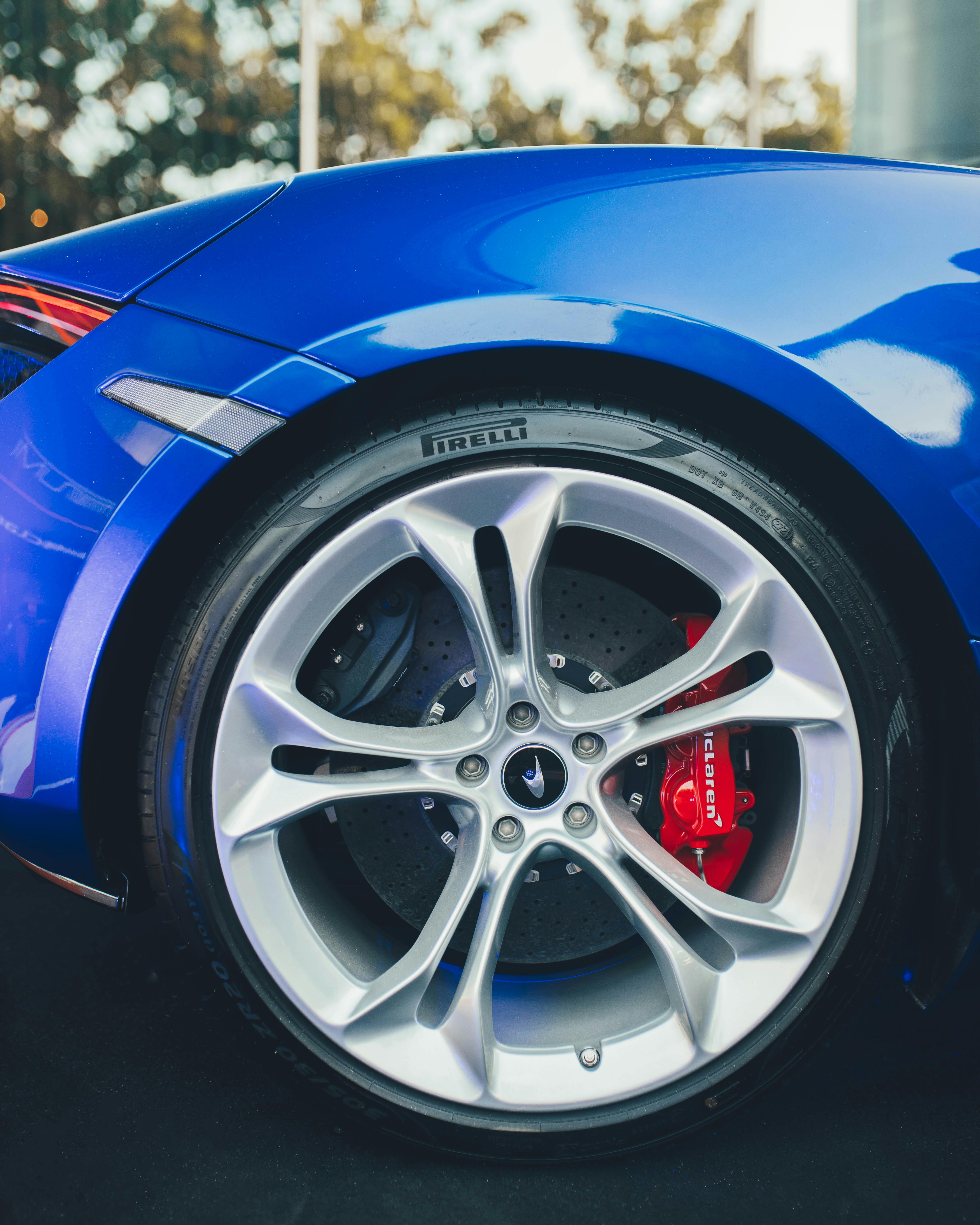 White Car With Gray 5 Lug Auto Rims · Free Stock Photo