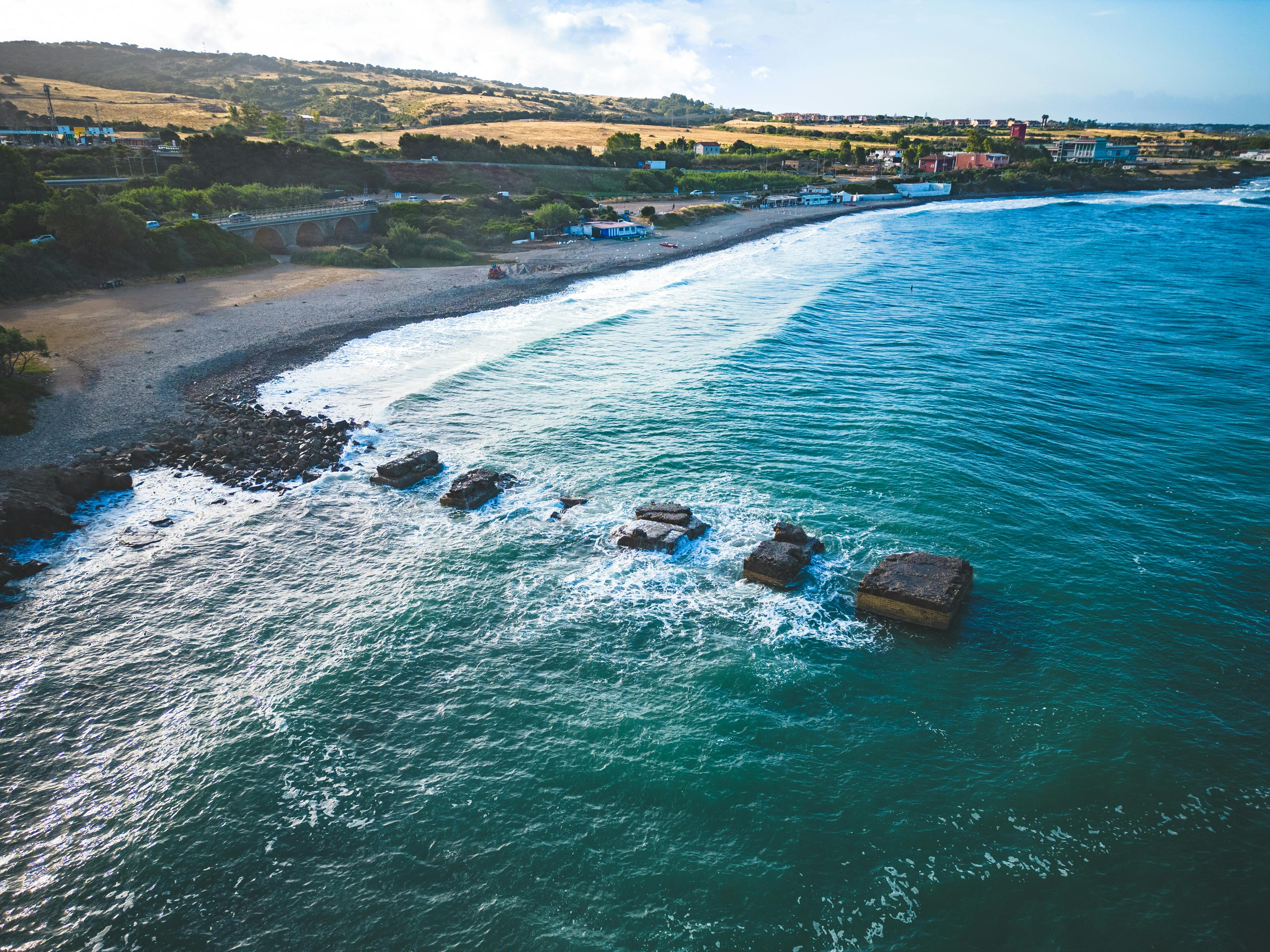 Aerial View of Rocks Formation on the Beach · Free Stock Photo