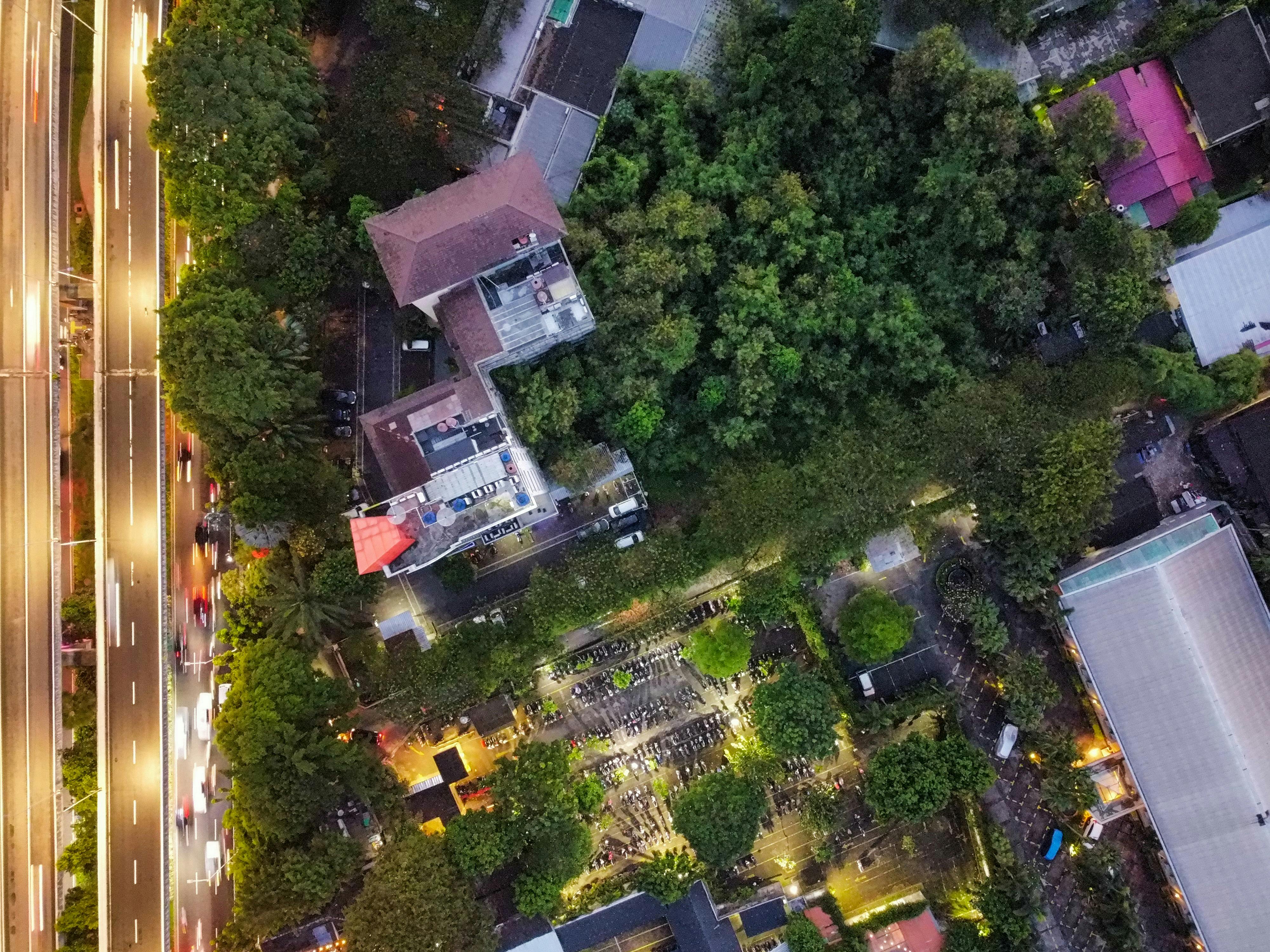 Top View of Parking Lot and Rooftops · Free Stock Photo