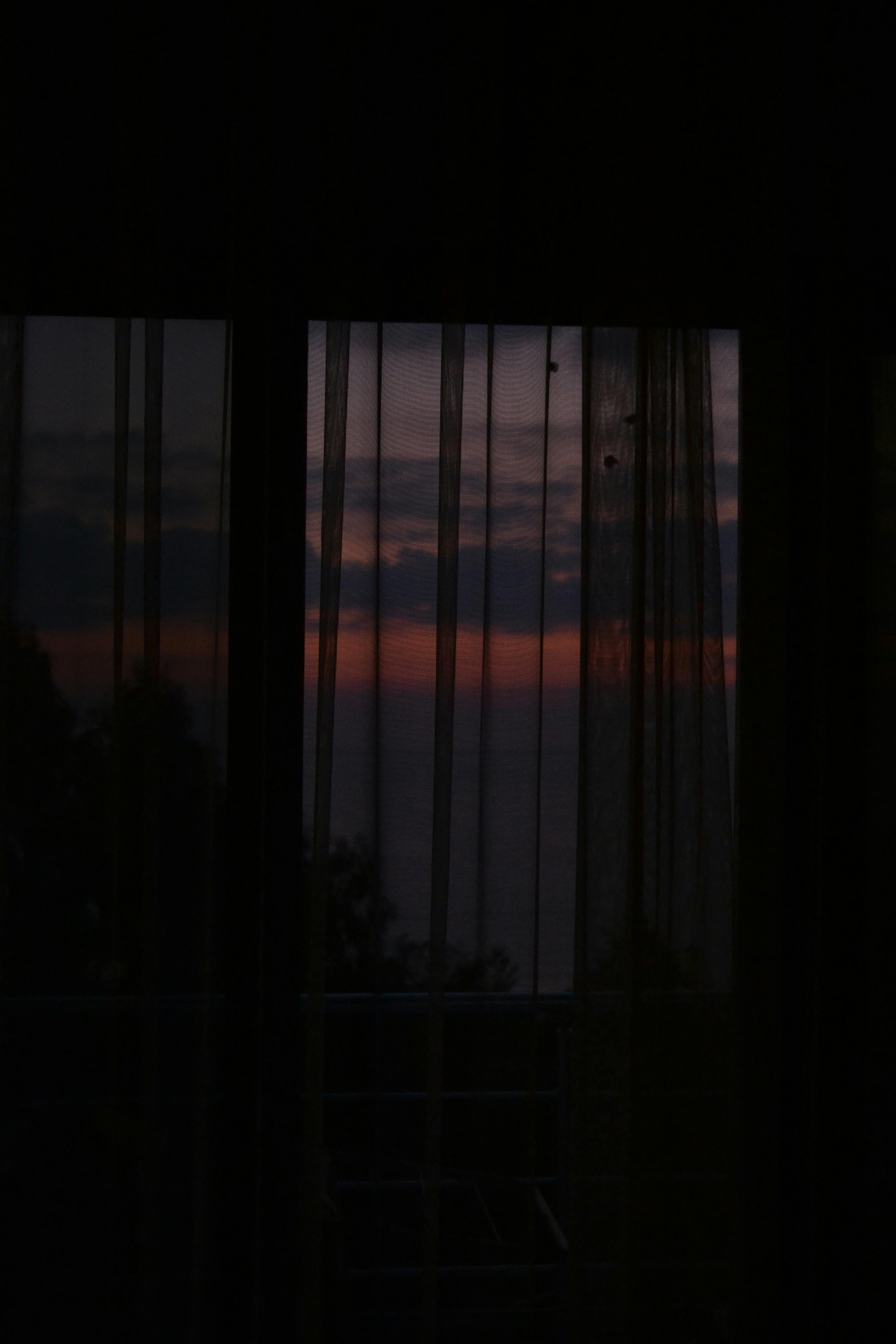 A View from a Window of Sky at Dusk · Free Stock Photo