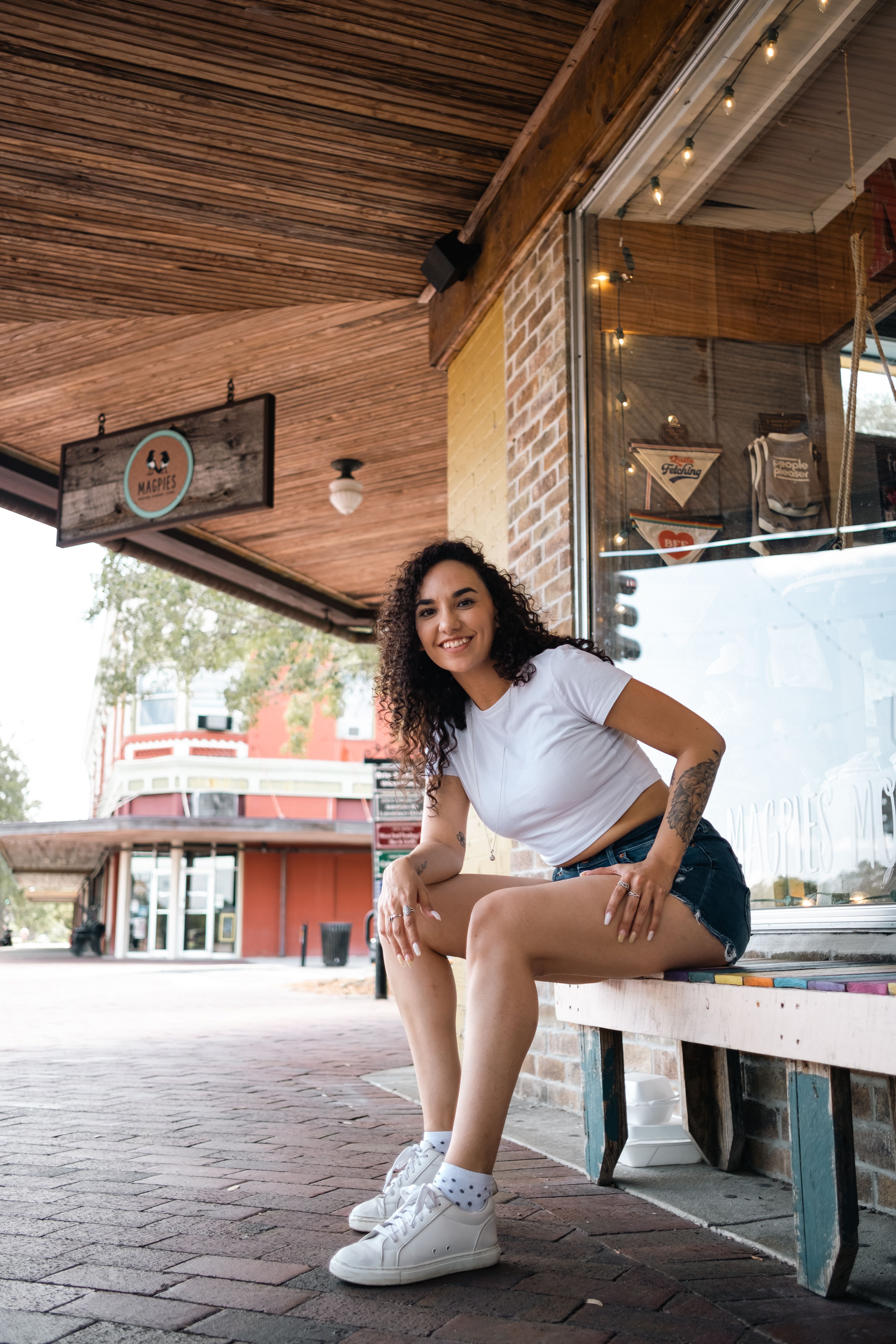 A Woman Wearing White Shirt and White Shoes · Free Stock Photo
