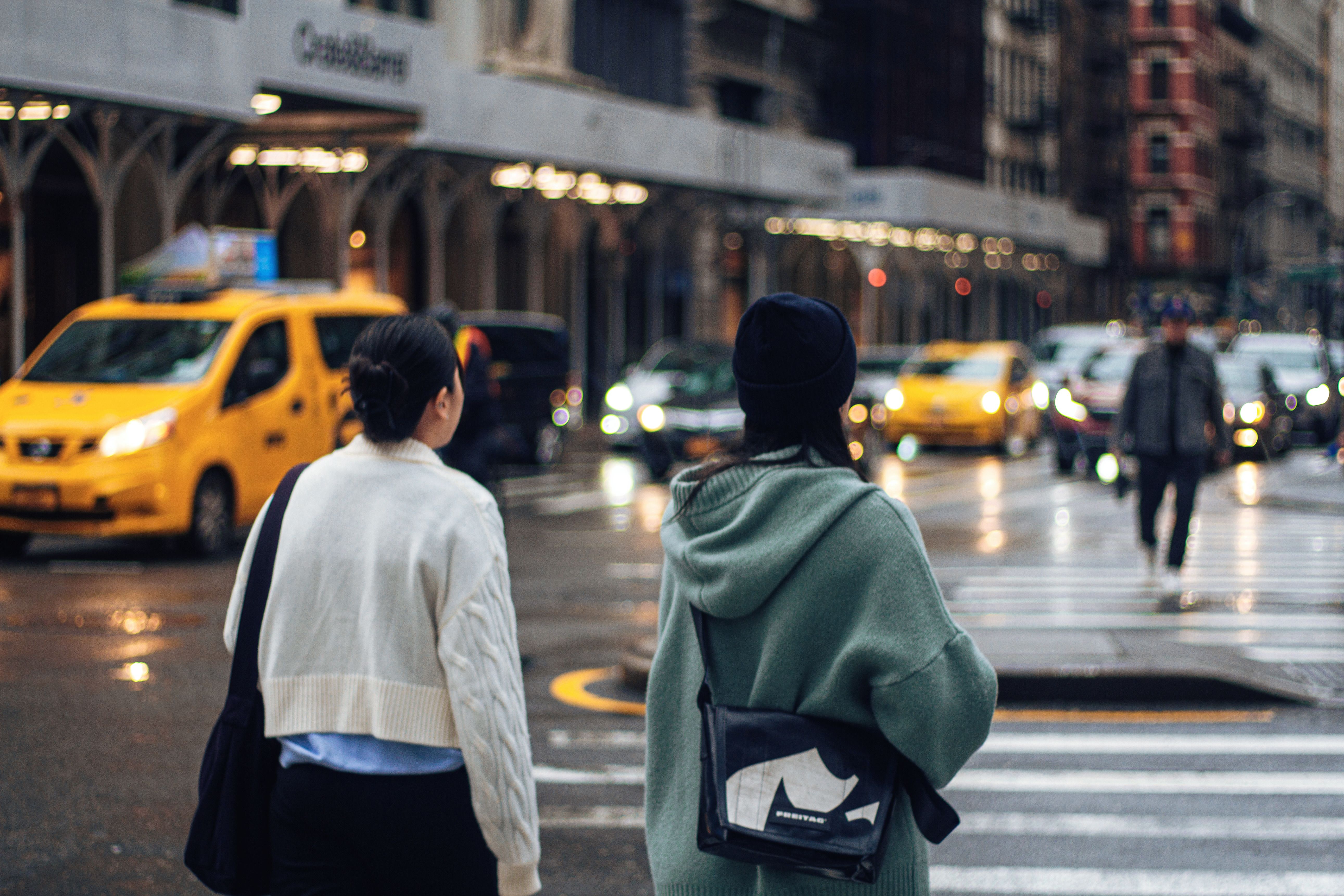 Back View of Two Women Crossing the Pedestrian Lane · Free Stock Photo
