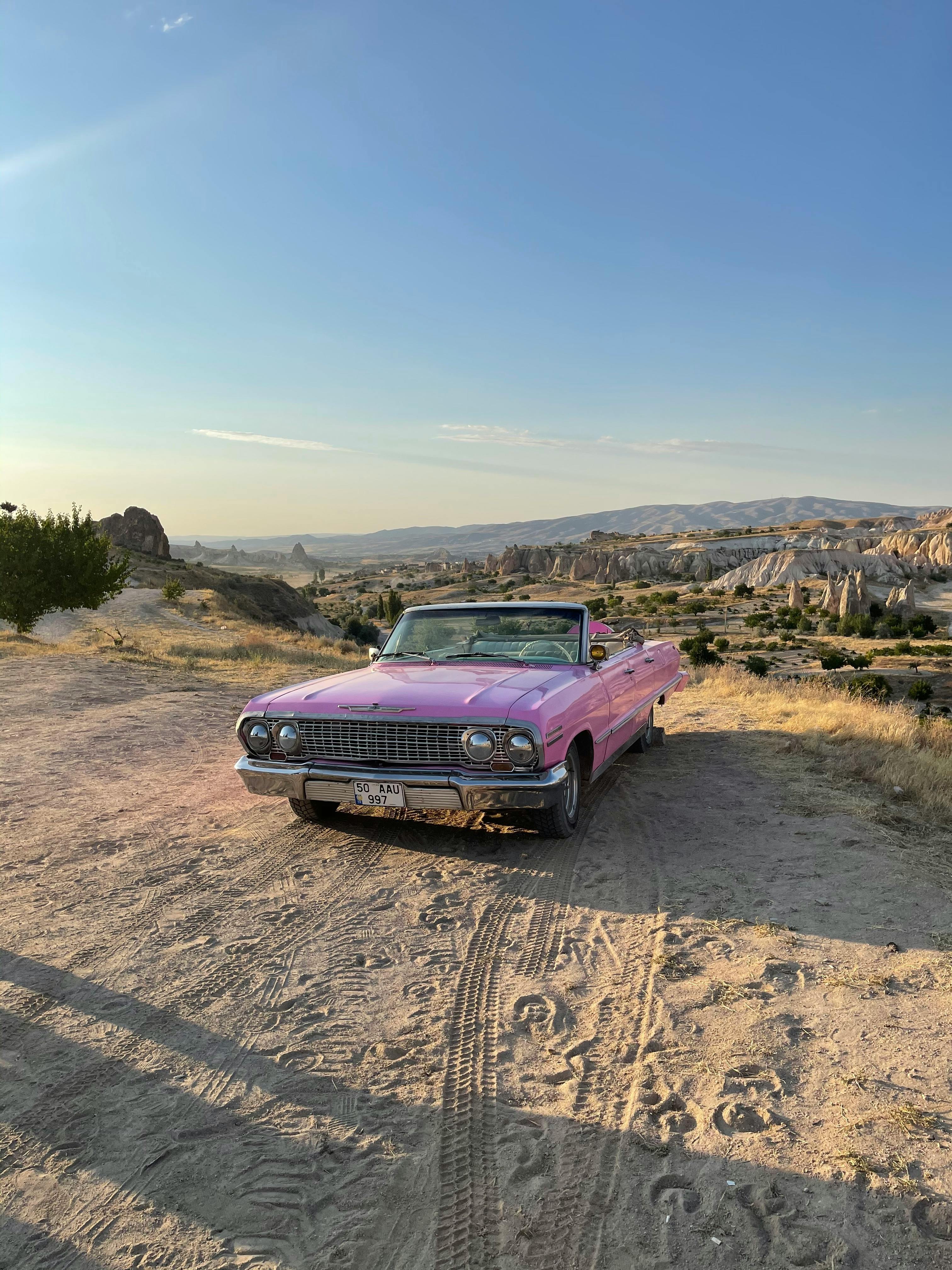 Pink Car on Brown Dirt Road · Free Stock Photo