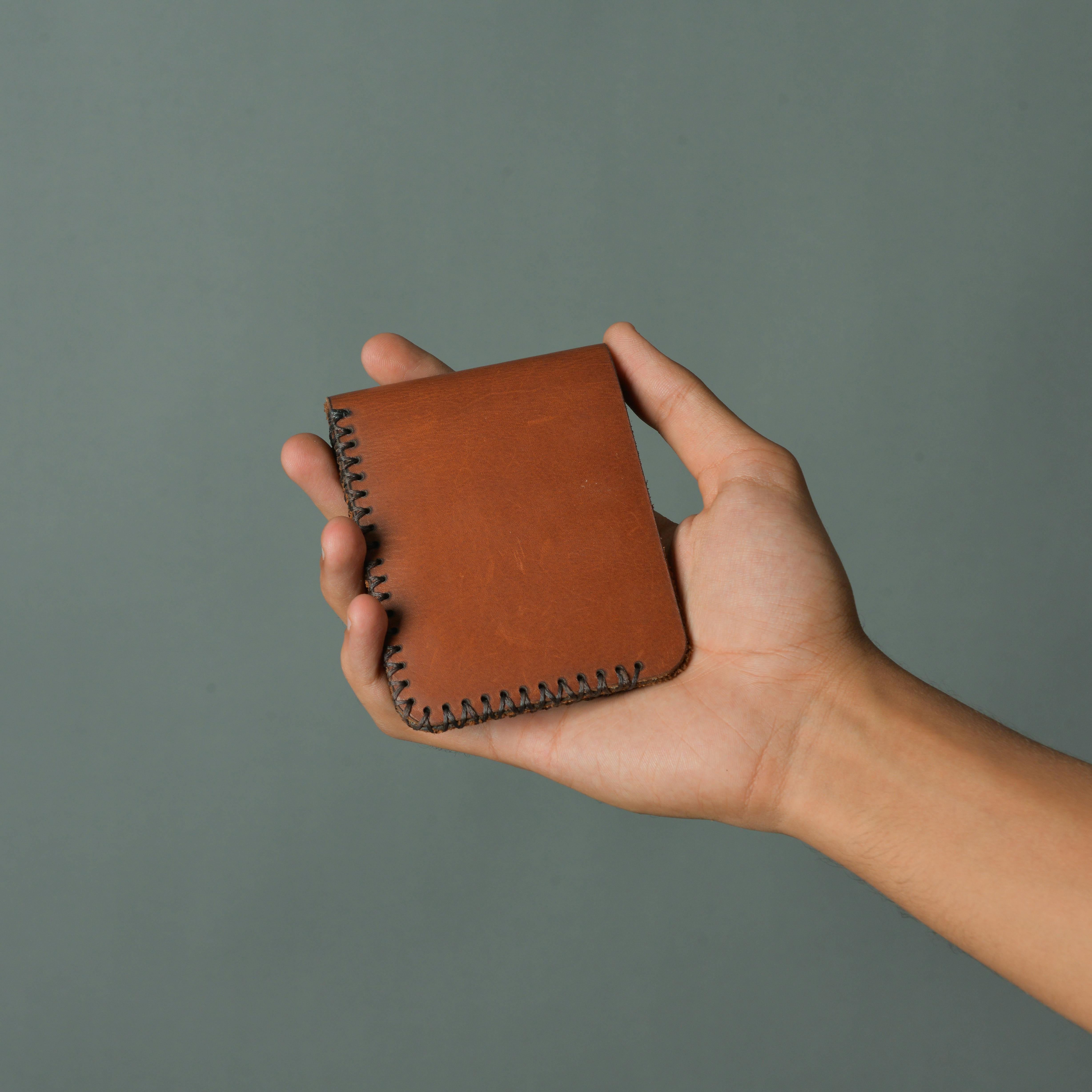Person Holding Brown Leather Wallet · Free Stock Photo