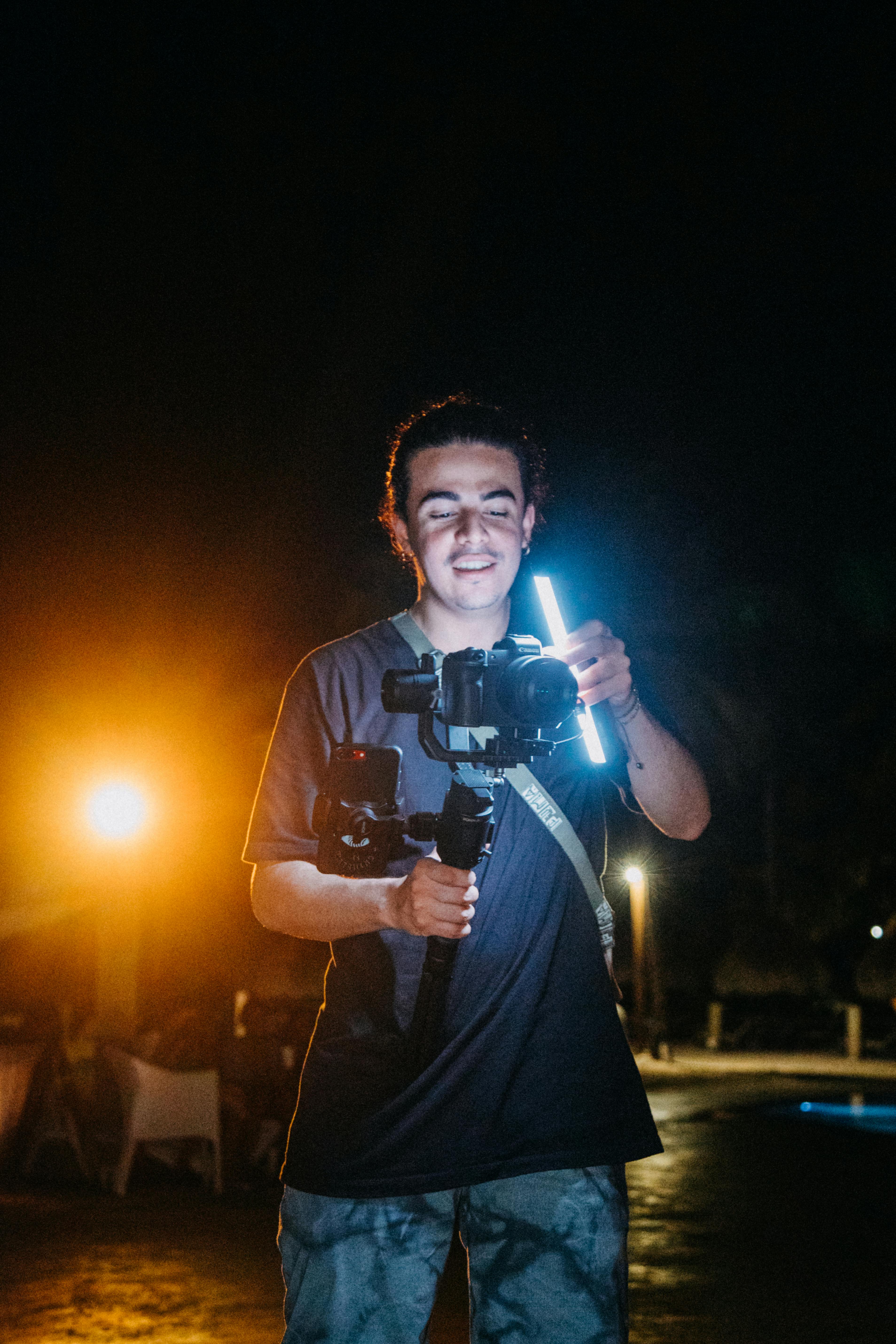 Man Holding Camcorder · Free Stock Photo