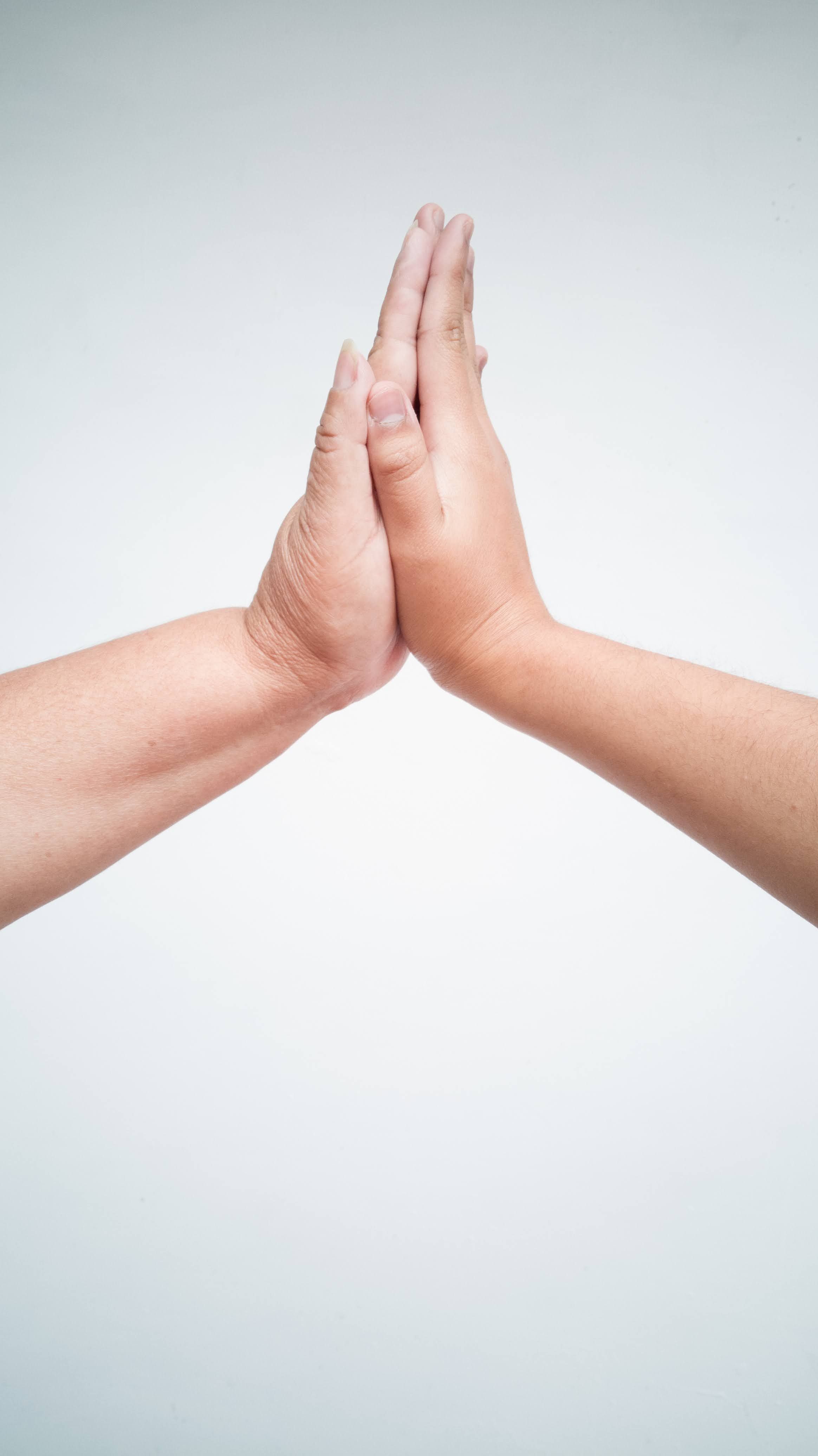 Close Up Photo of People Doing High Five · Free Stock Photo