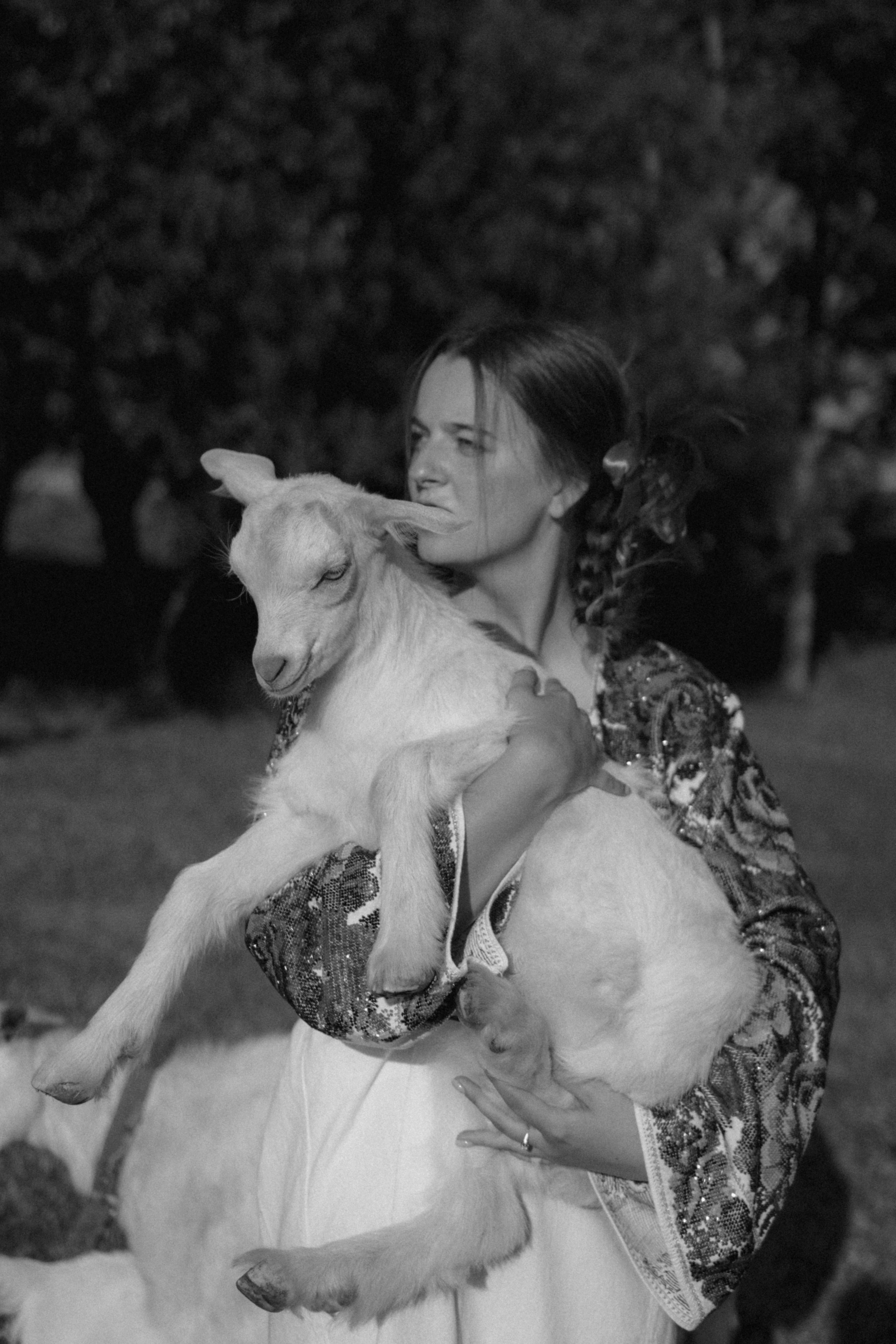 Woman Carrying a Goat · Free Stock Photo