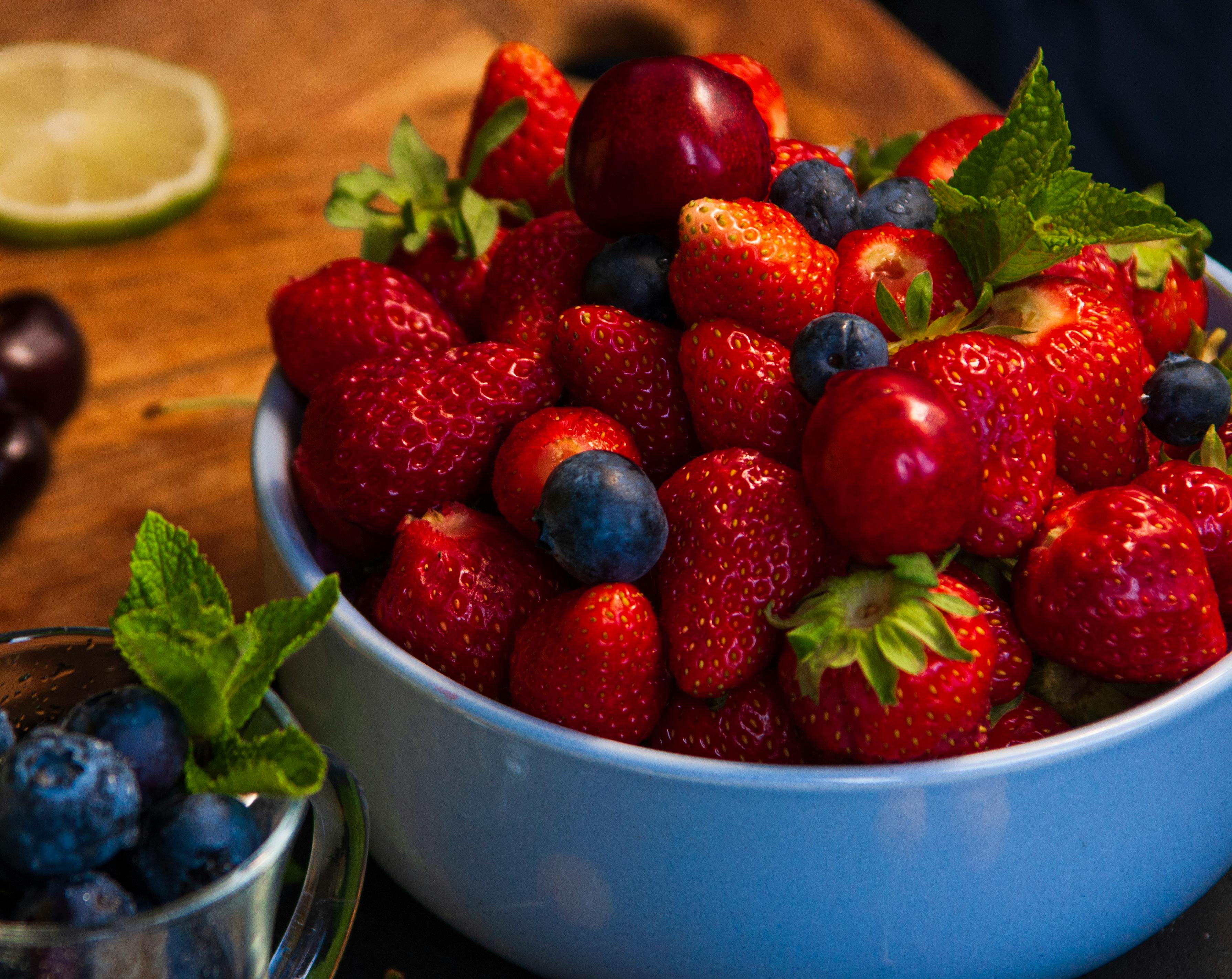 Close Up Photo of Fruits on Blue Bowl · Free Stock Photo
