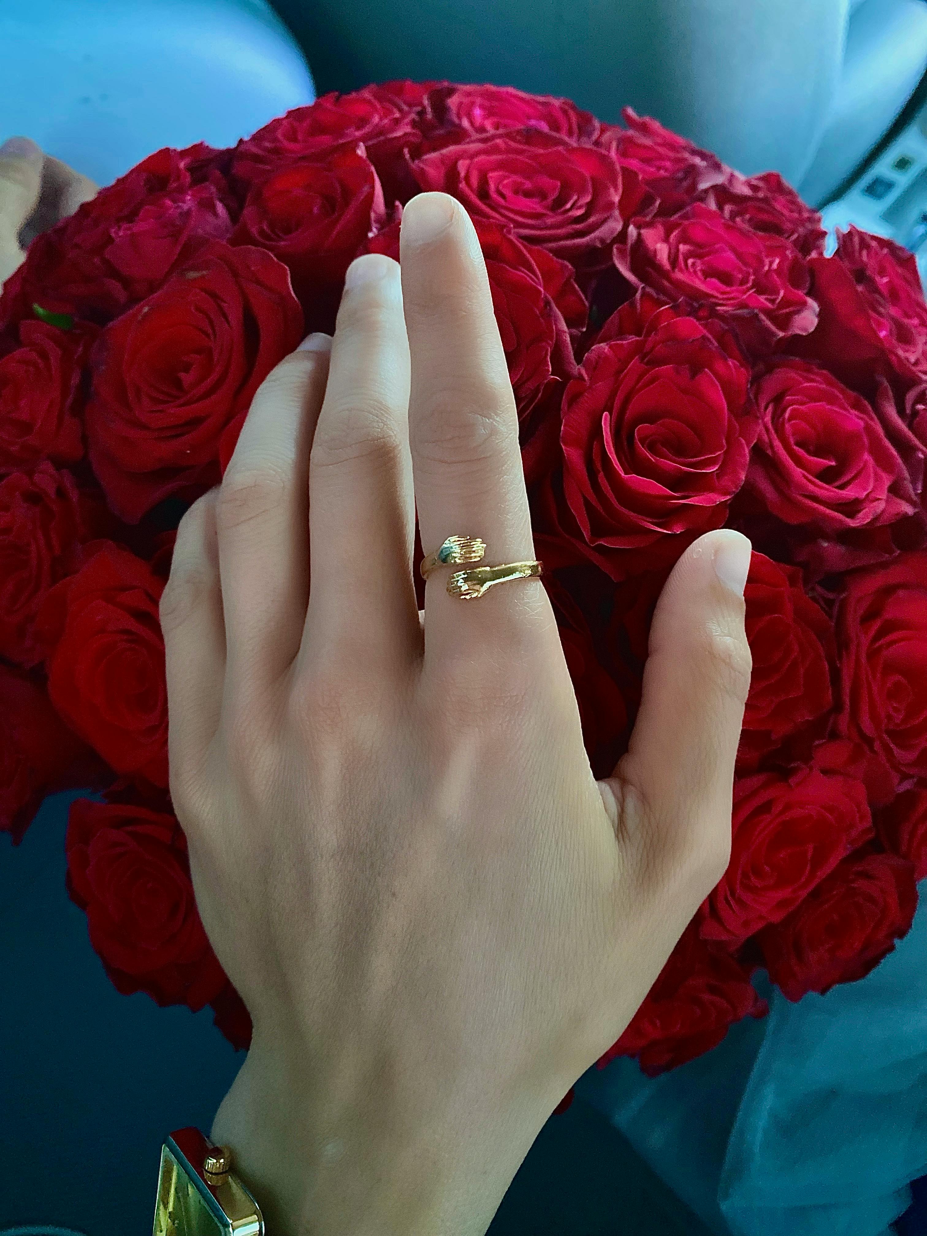 Person Wearing Gold Ring while Touching Red Roses · Free Stock Photo