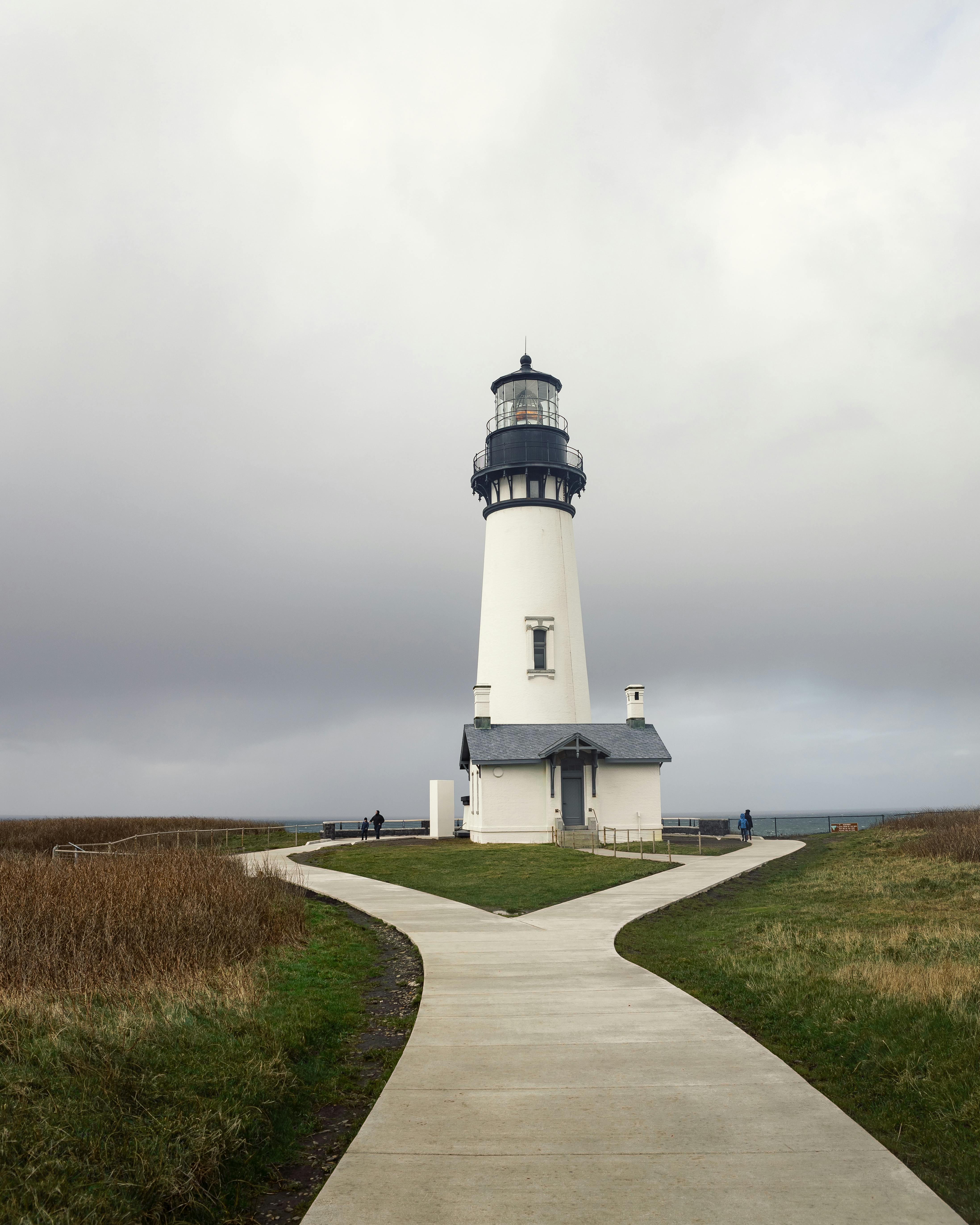A Lighthouse Under the Blue Sky · Free Stock Photo