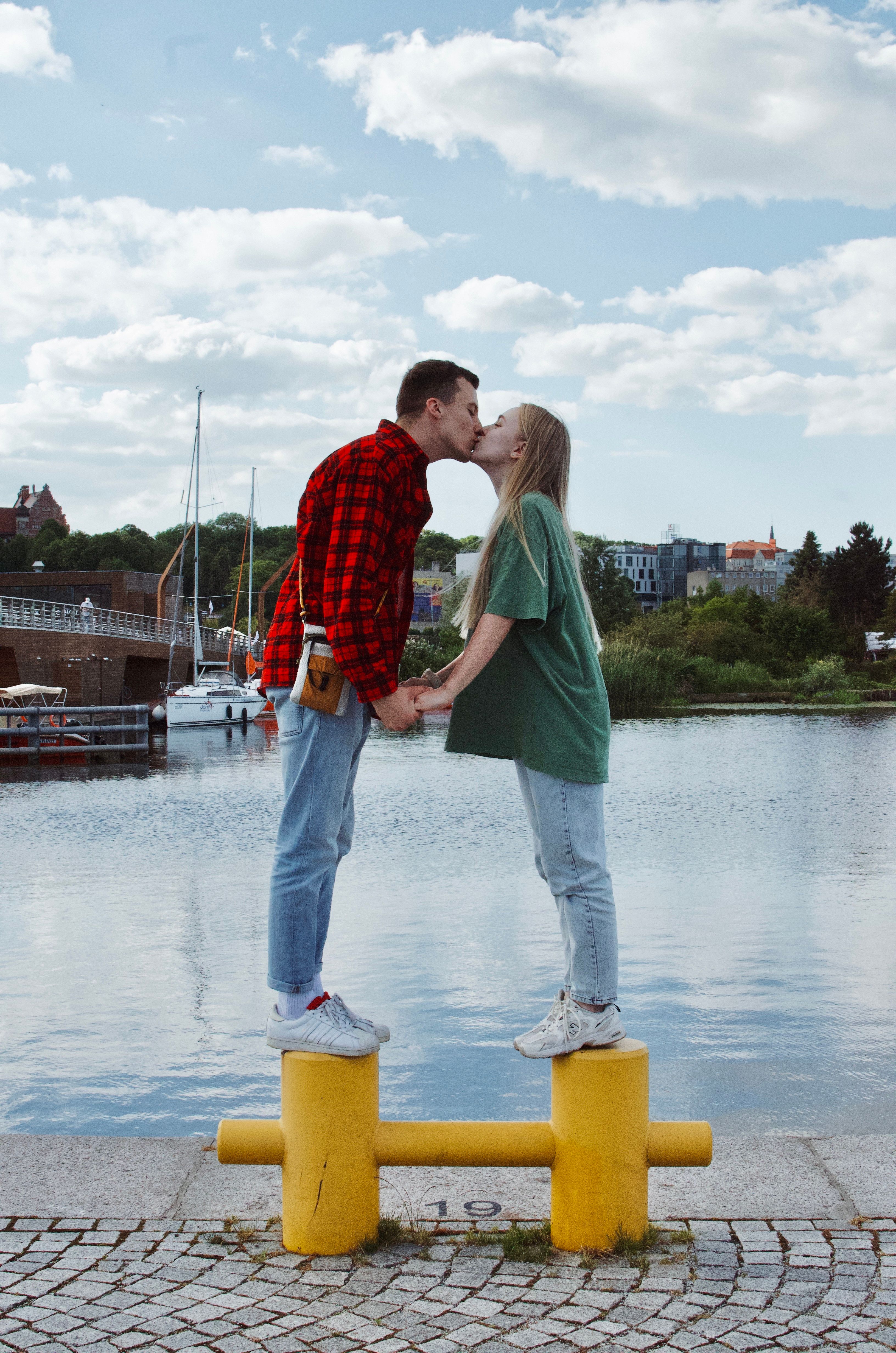Couple Kissing near Body of Water · Free Stock Photo