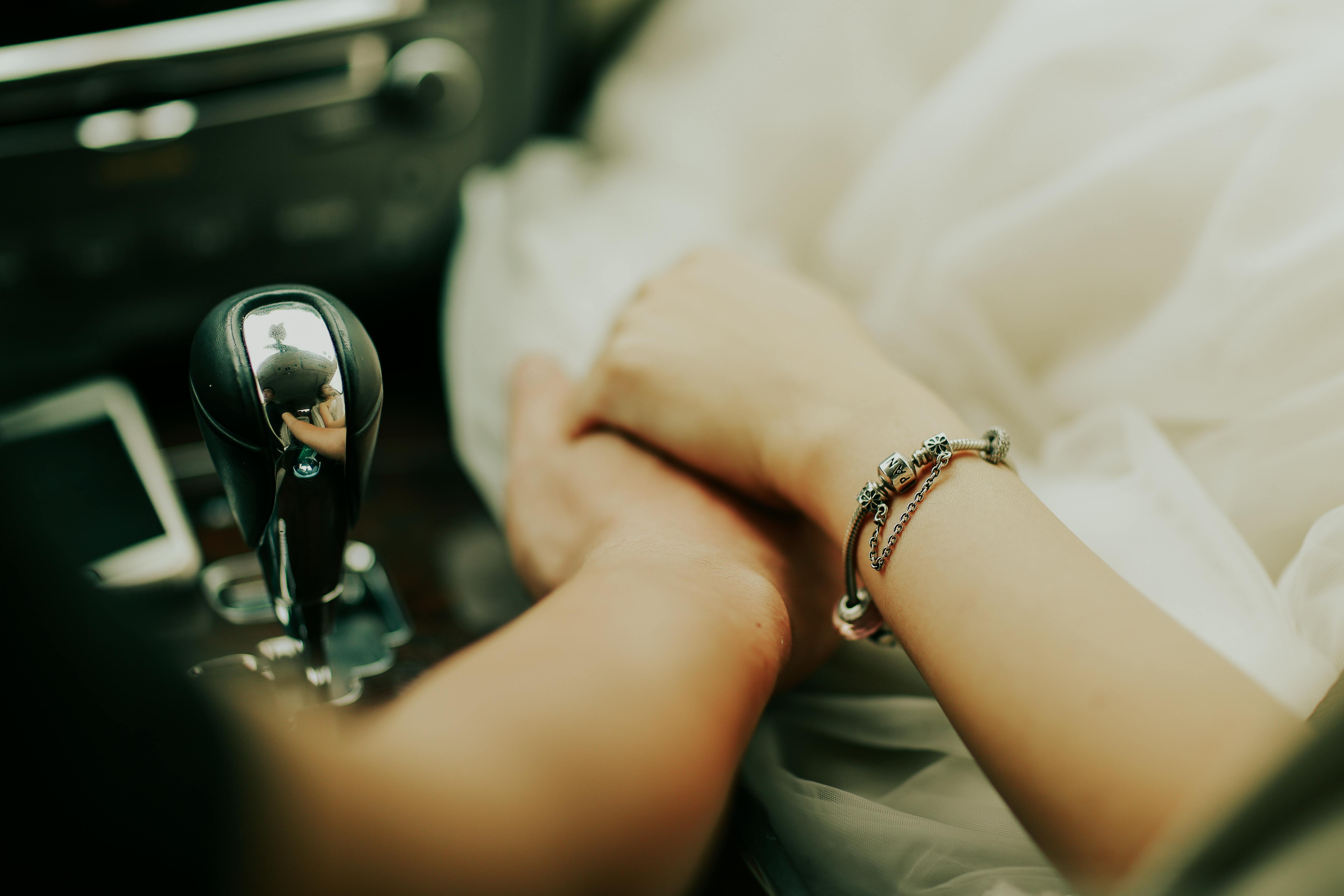 Close-Up Shot of Two People Holding Hands Together · Free Stock Photo