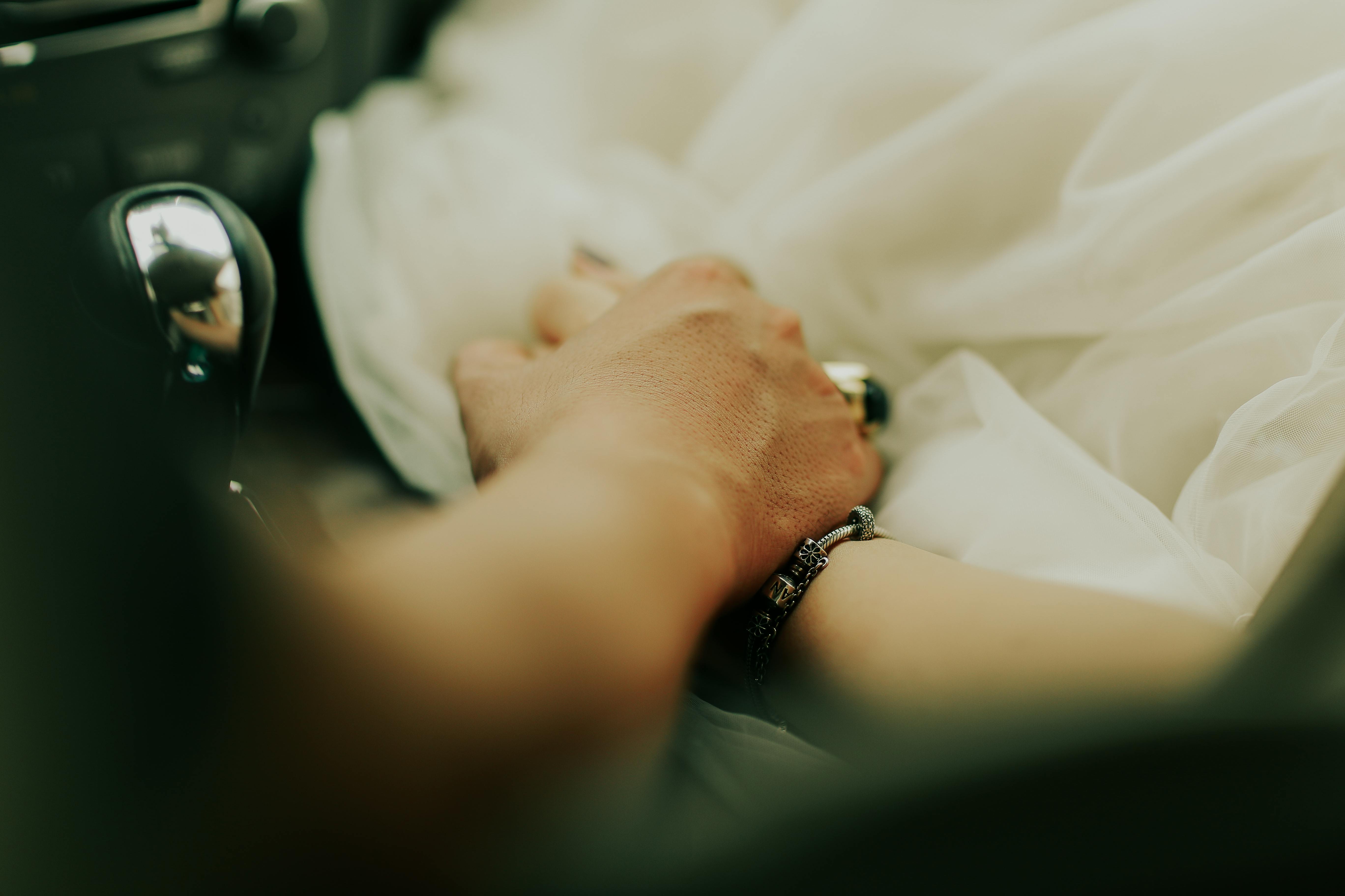 Photo of a Person's Hand Holding an Iron · Free Stock Photo