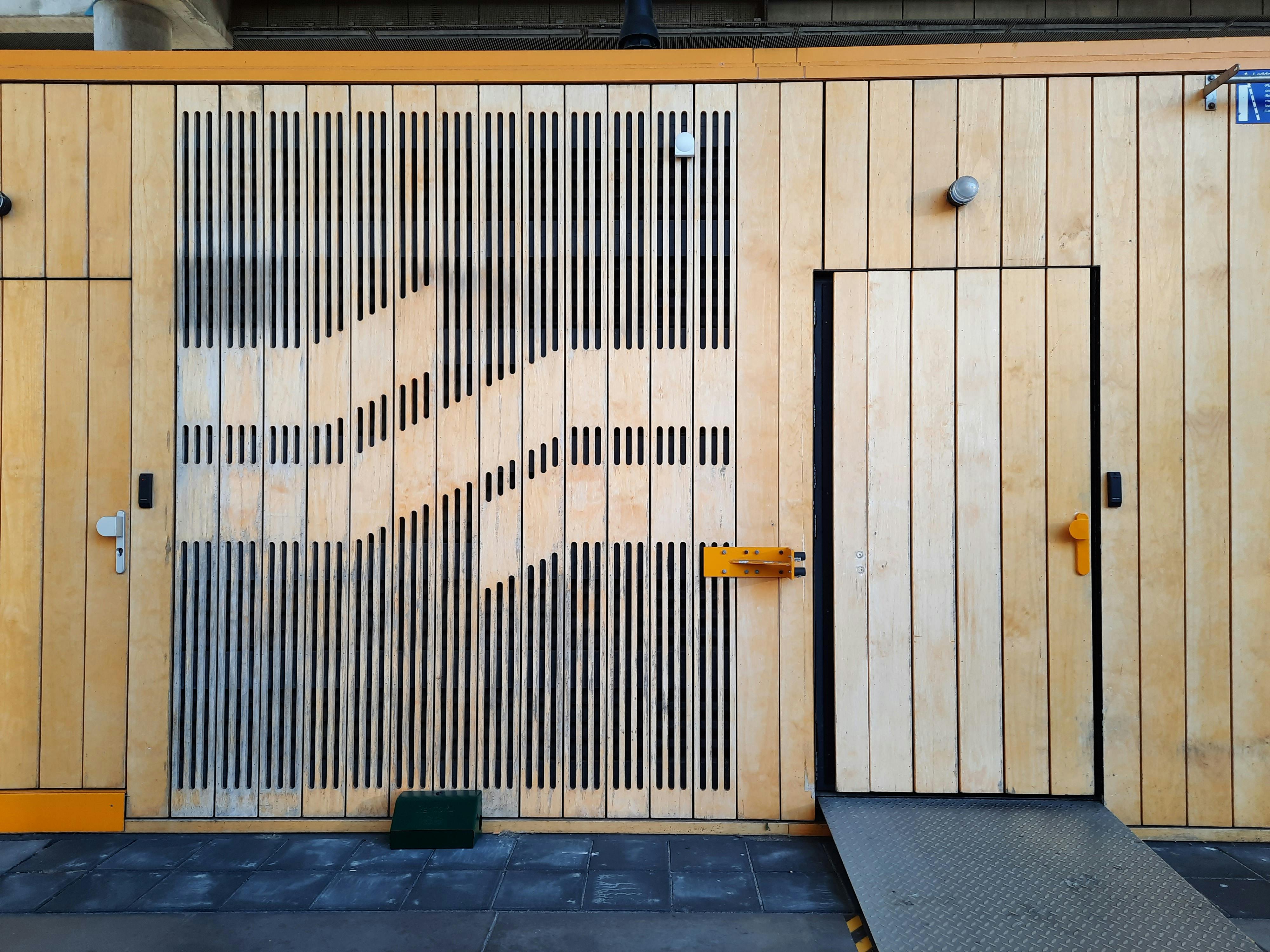 A Metal Ramp on a Wooden Door · Free Stock Photo