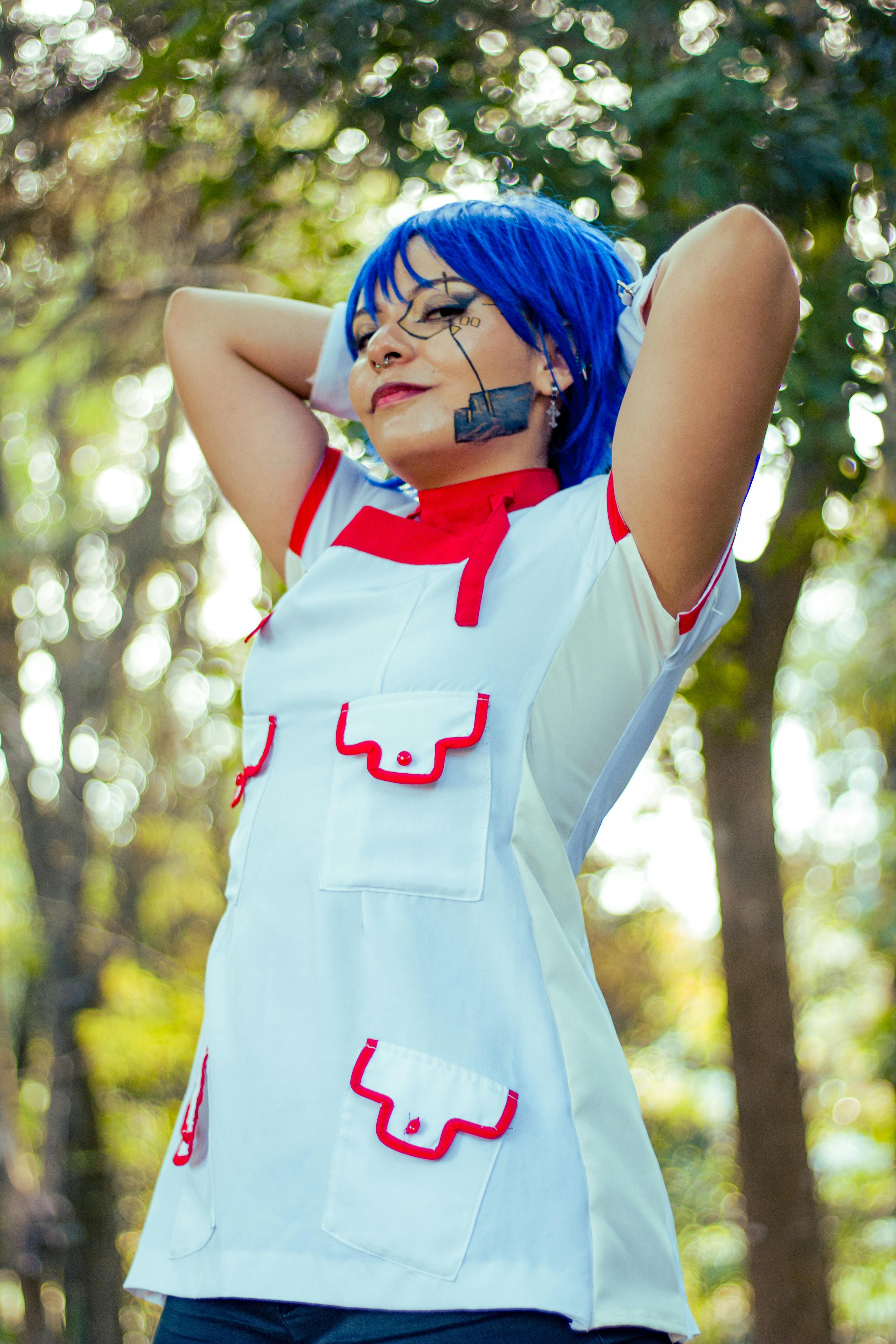 Cosplayer with Blue Hair Posing at the Camera · Free Stock Photo