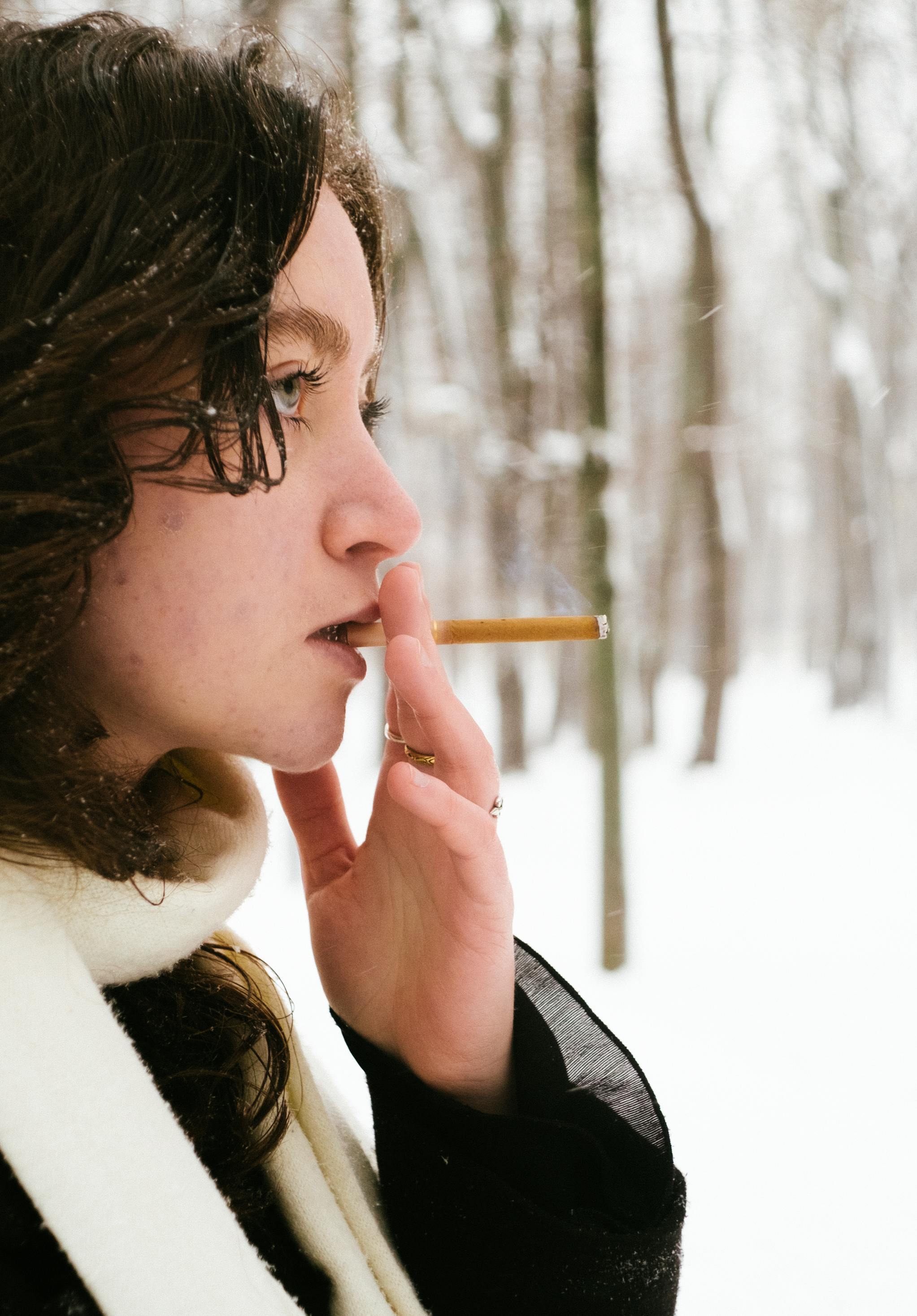 Woman Smoking Cigarette During Winter · Free Stock Photo