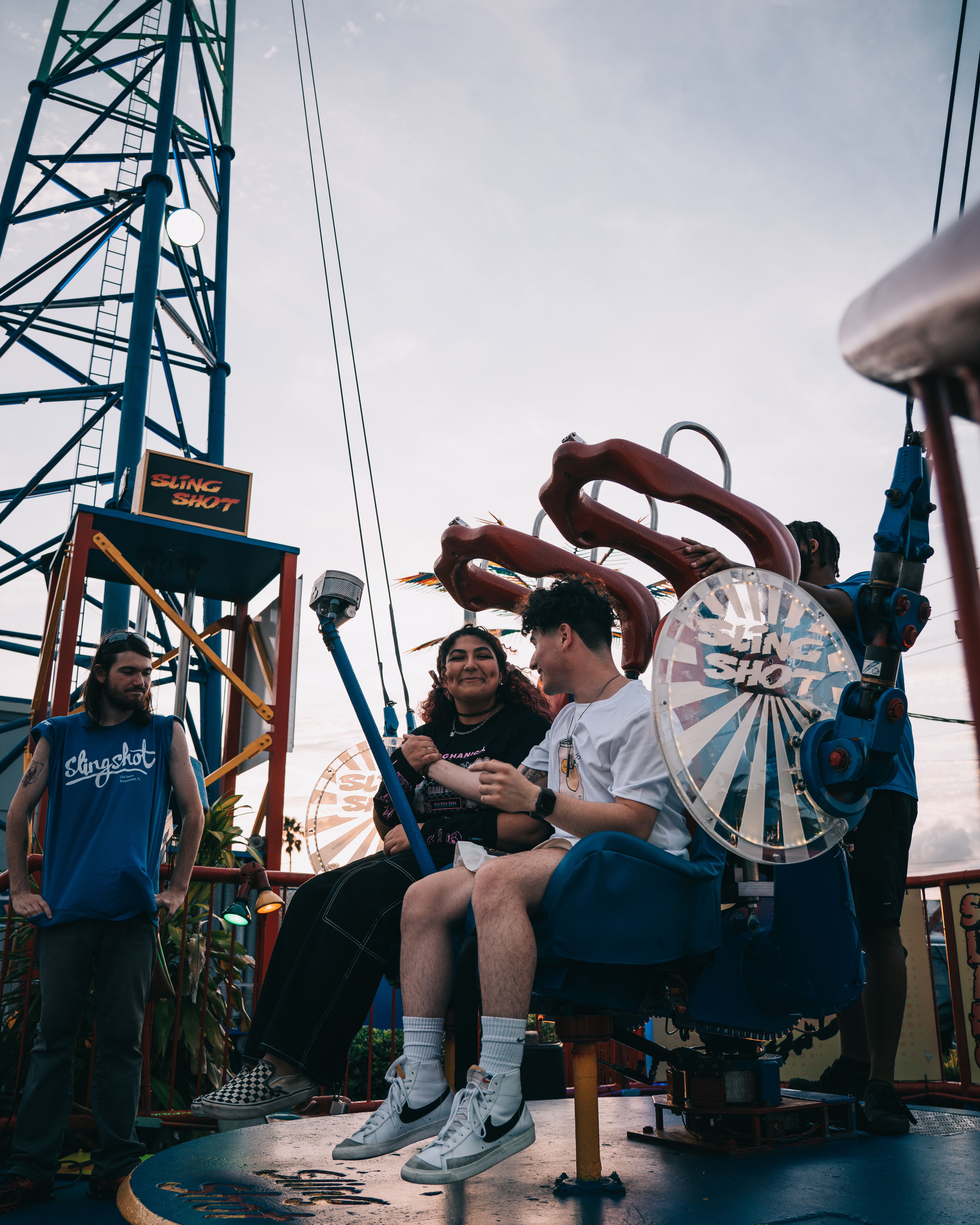 A Man and Woman Riding on the Sling Shot · Free Stock Photo