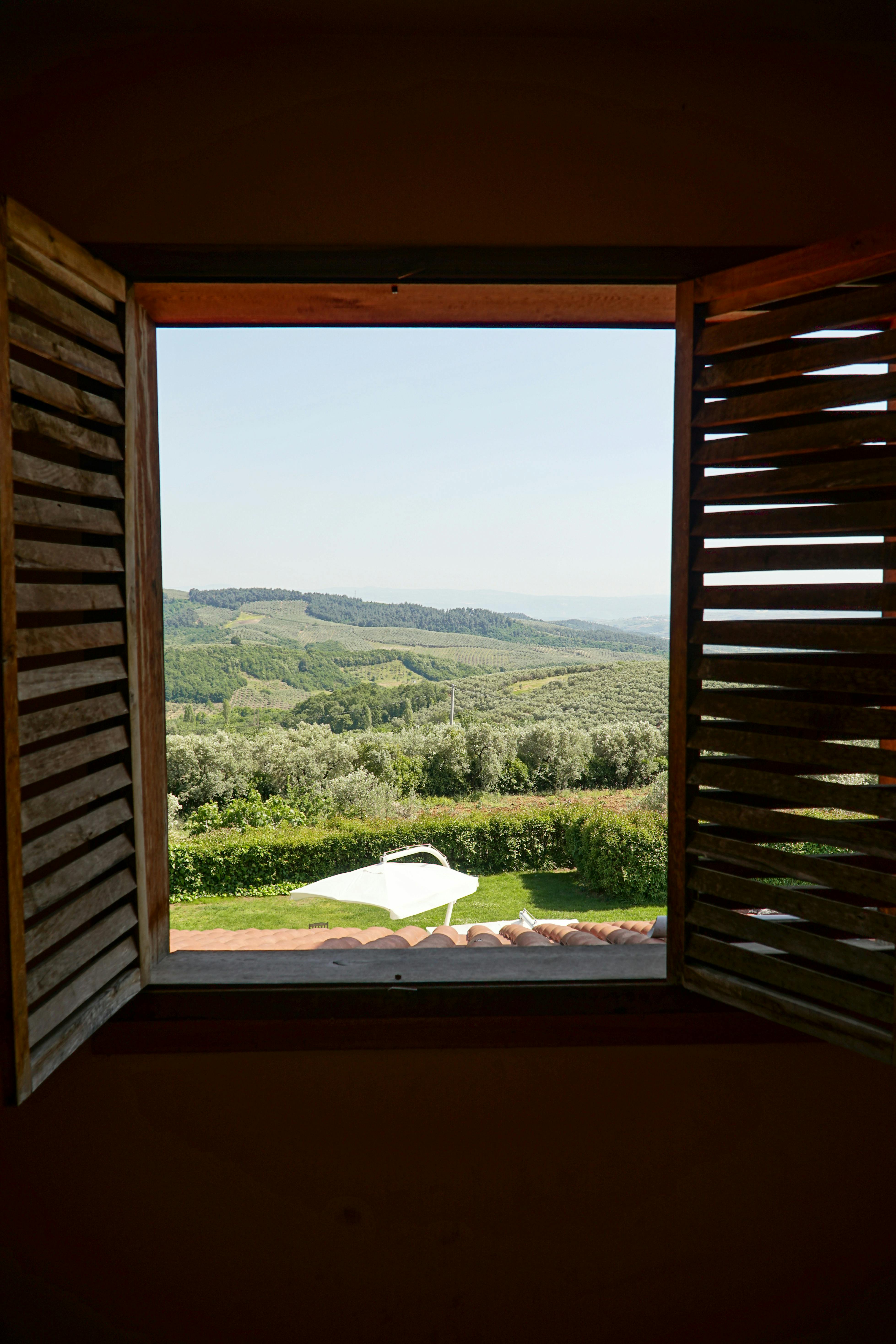 Scenic View Outside a Wooden Window · Free Stock Photo