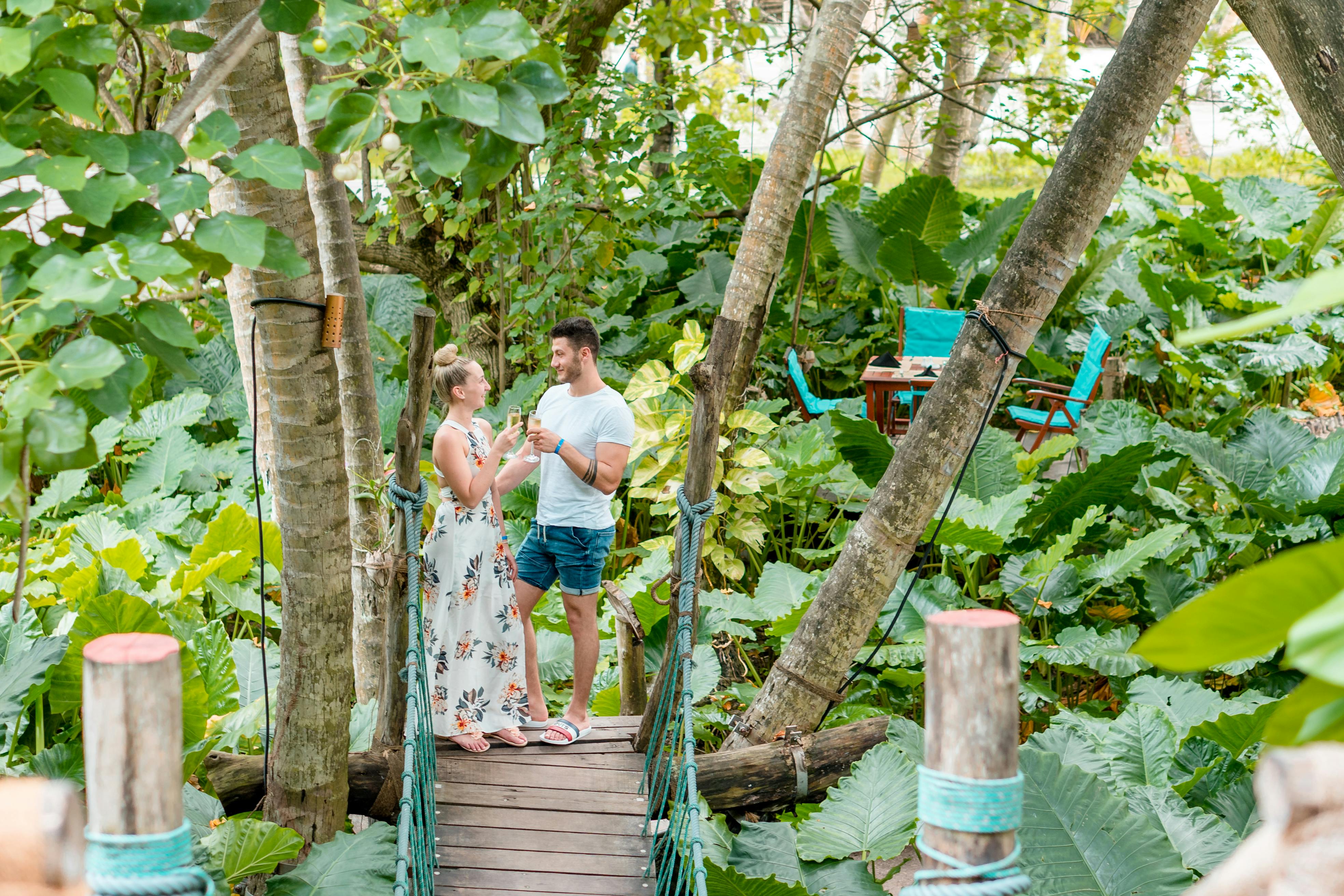 Romantic Couple Standing between Trees · Free Stock Photo