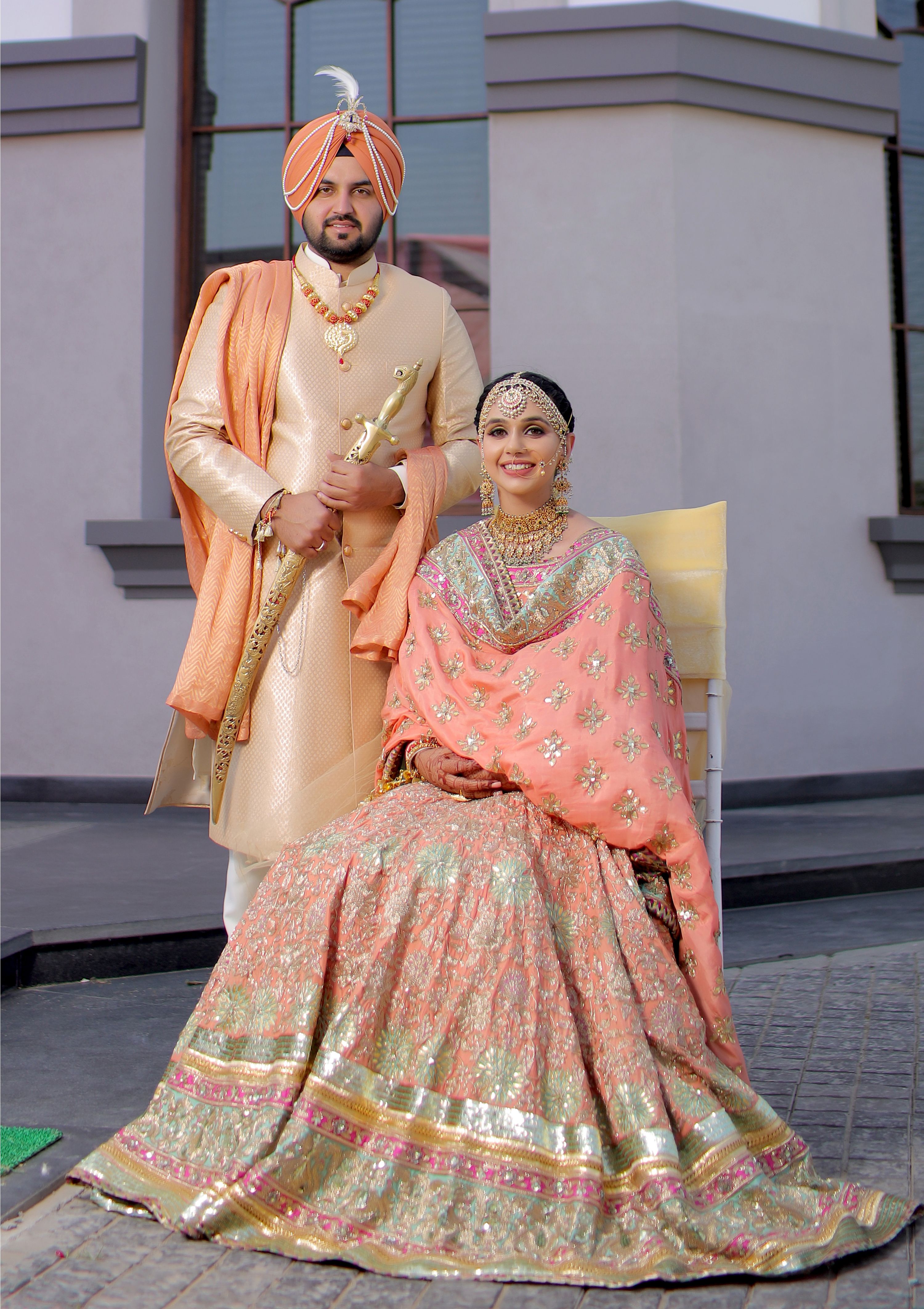 Bride and Groom Wearing Traditional Wedding Outfit while Smiling at the ...