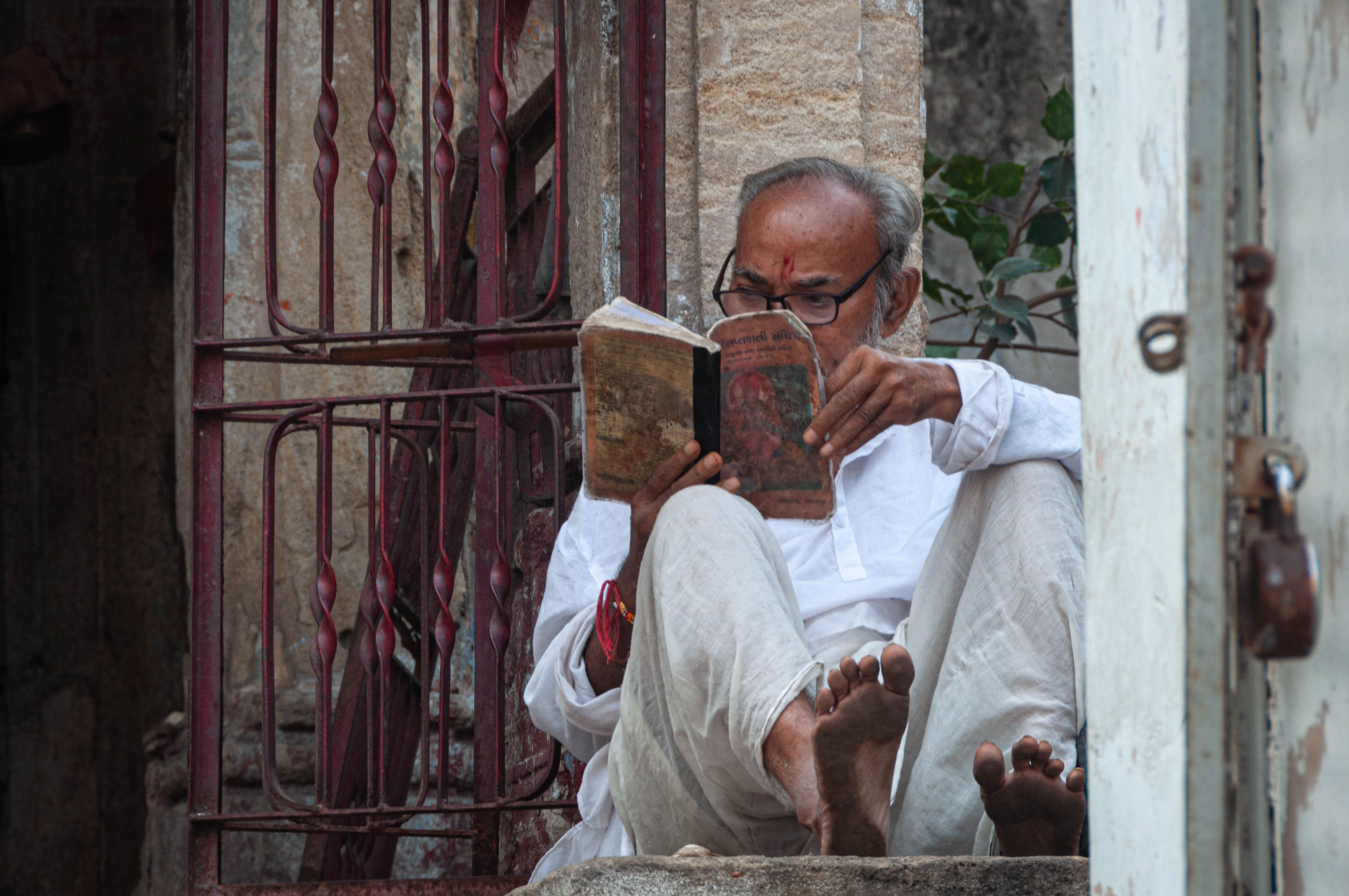Close Up Photo of Man Reading Book · Free Stock Photo