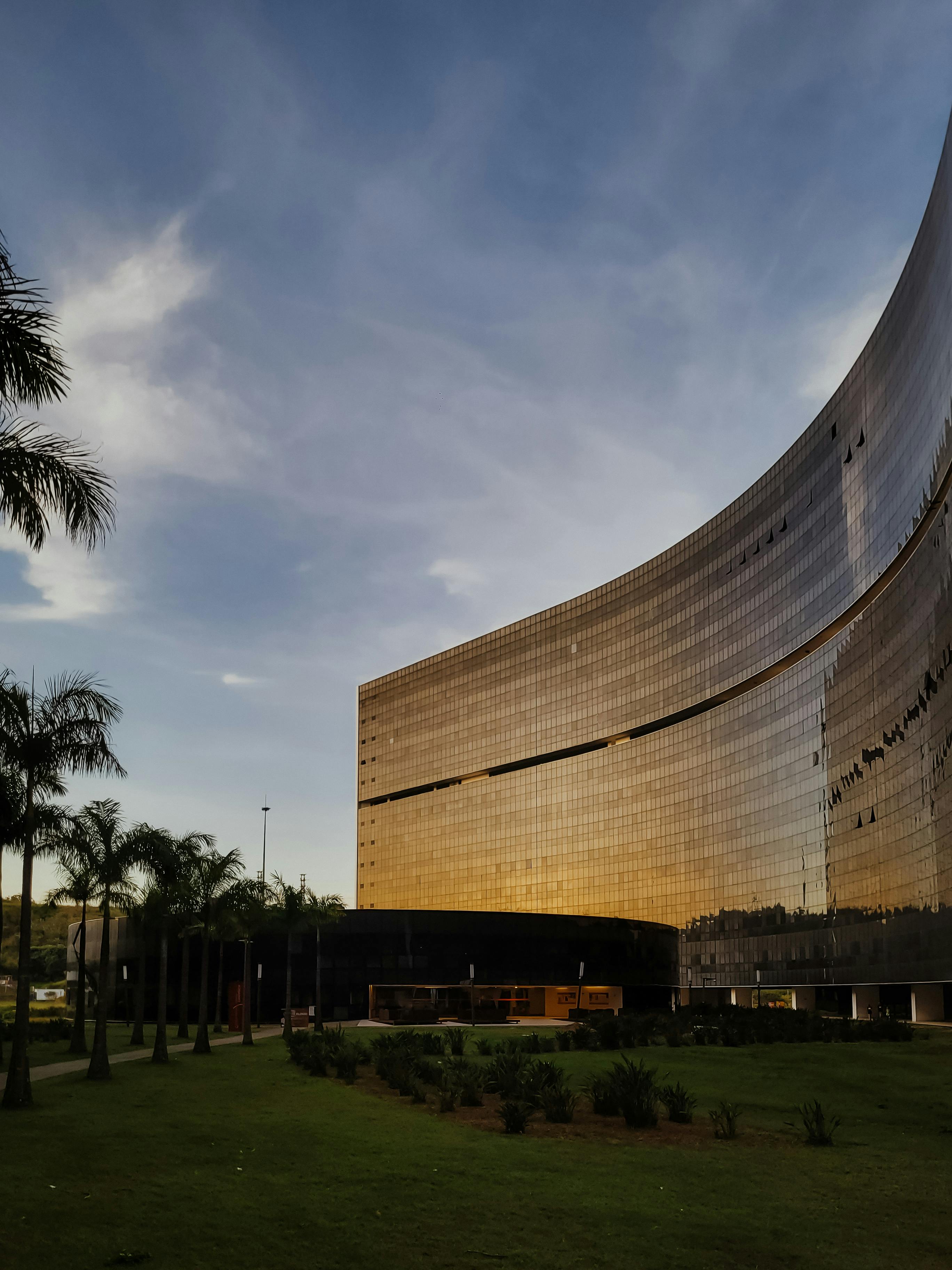 Curtain Wall Building Under Clear Blue Sky · Free Stock Photo