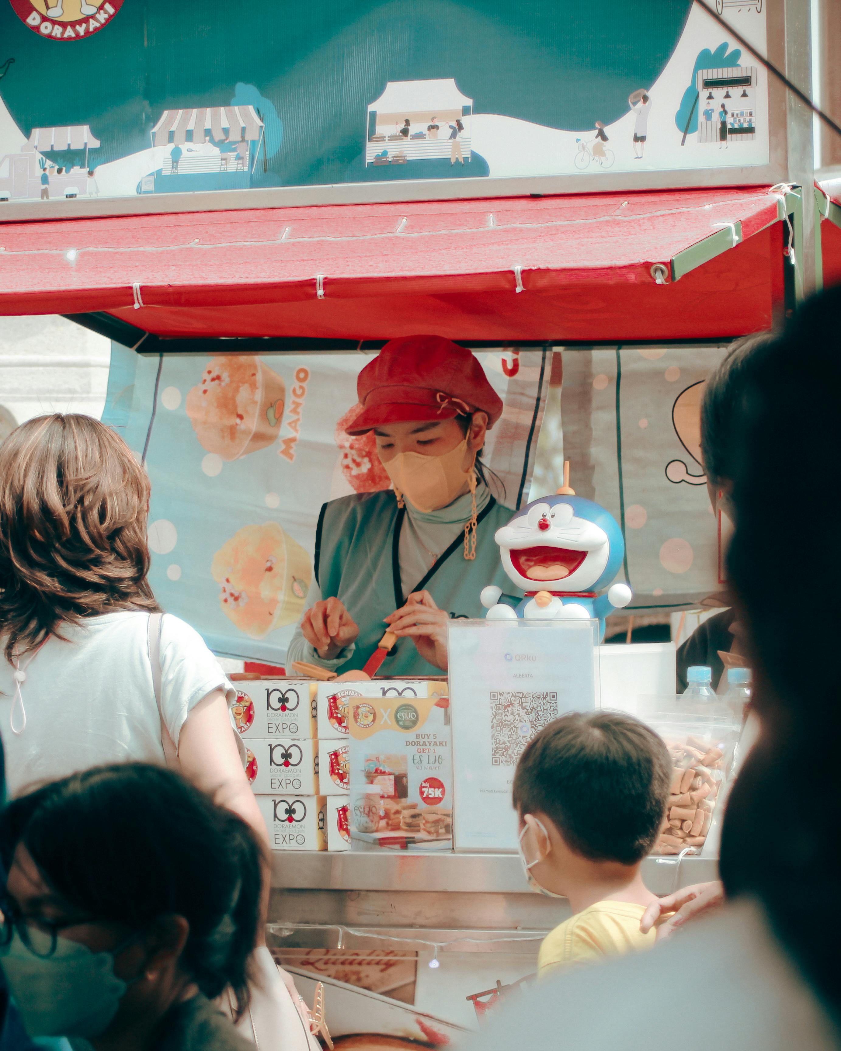 Street Vendor Wearing Red Cap · Free Stock Photo