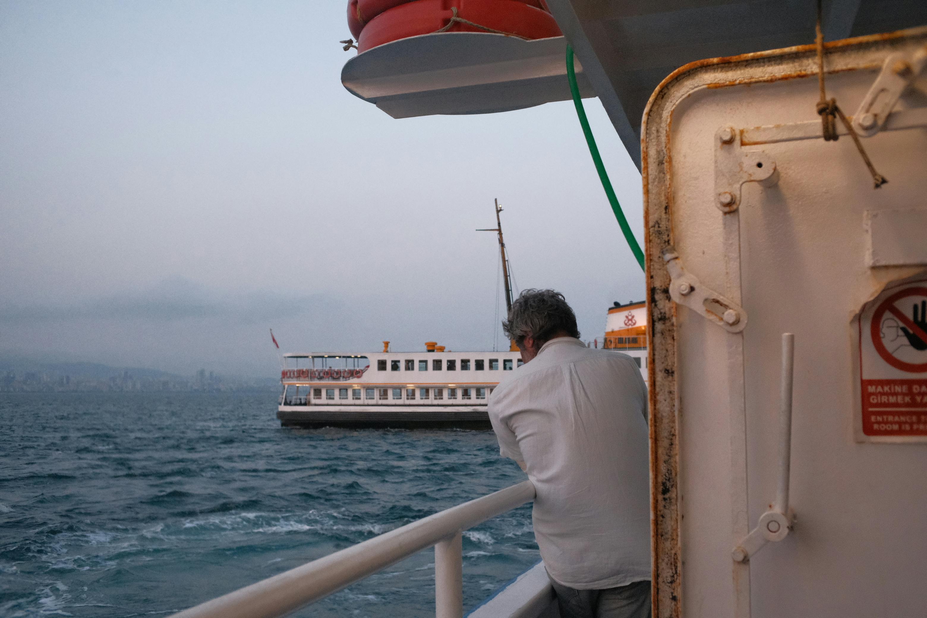Back View of a Man Riding a Ship · Free Stock Photo