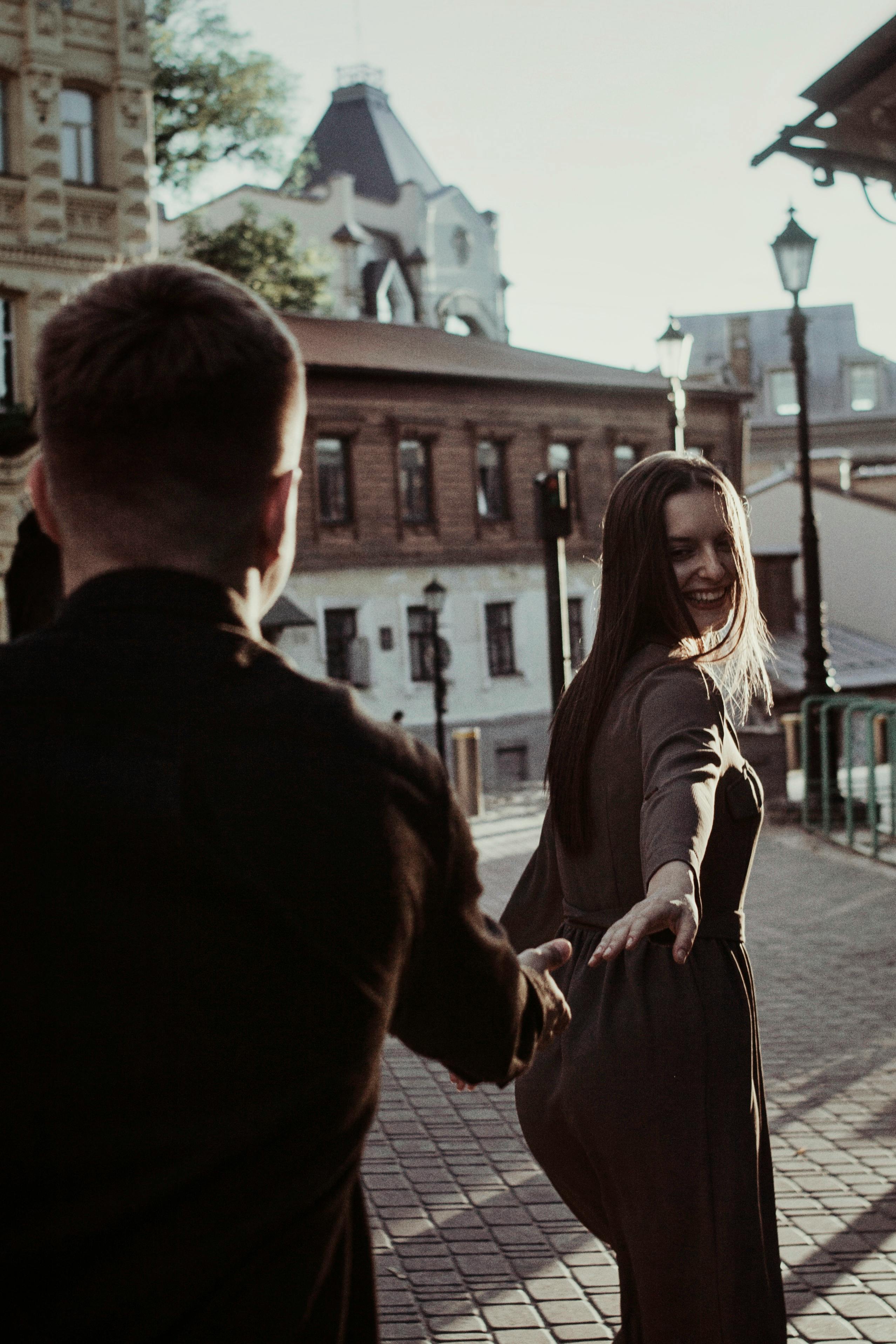Happy Couple reaching for each other's Hands · Free Stock Photo