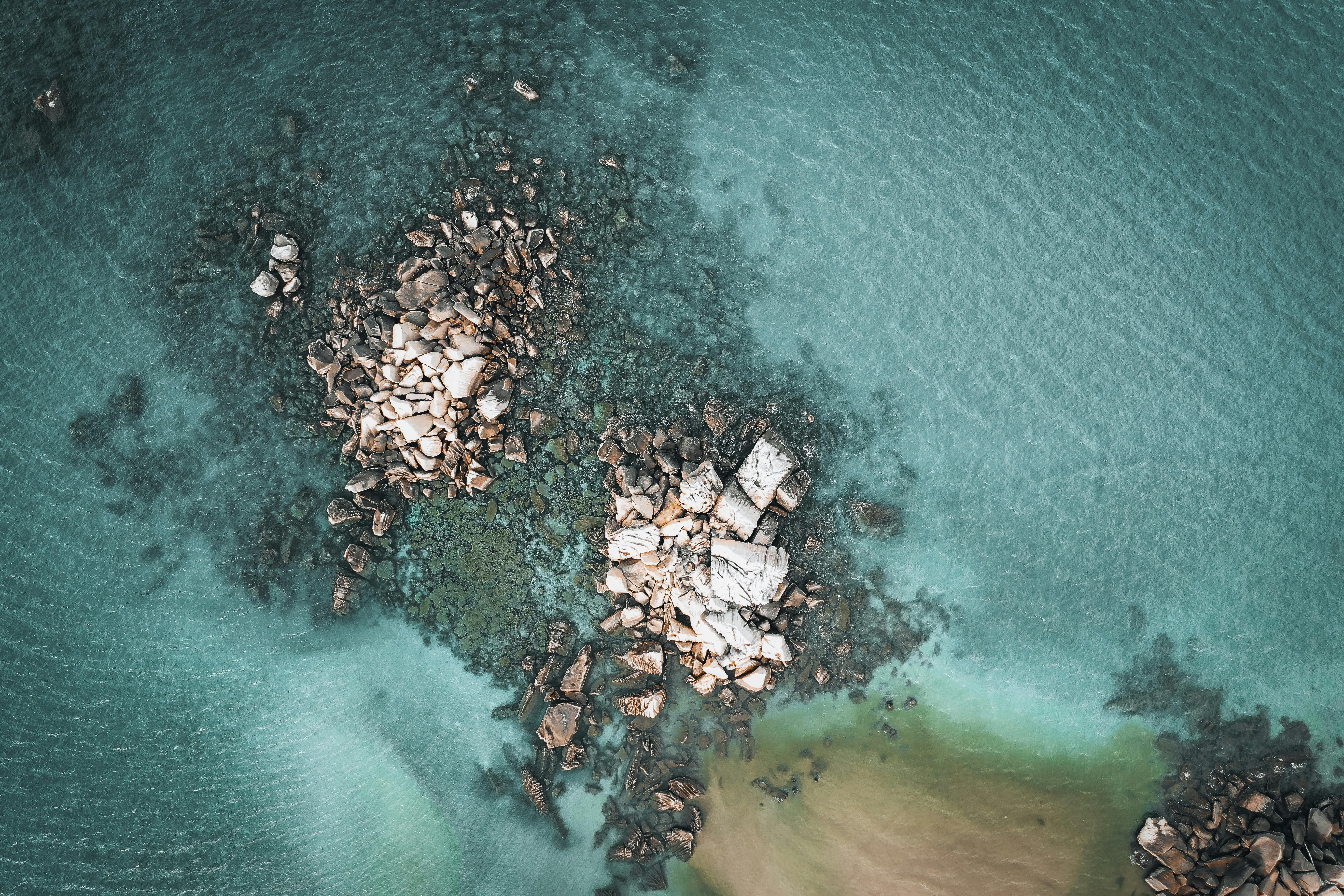 An Aerial Photography of a Rocky Shore on the Beach · Free Stock Photo