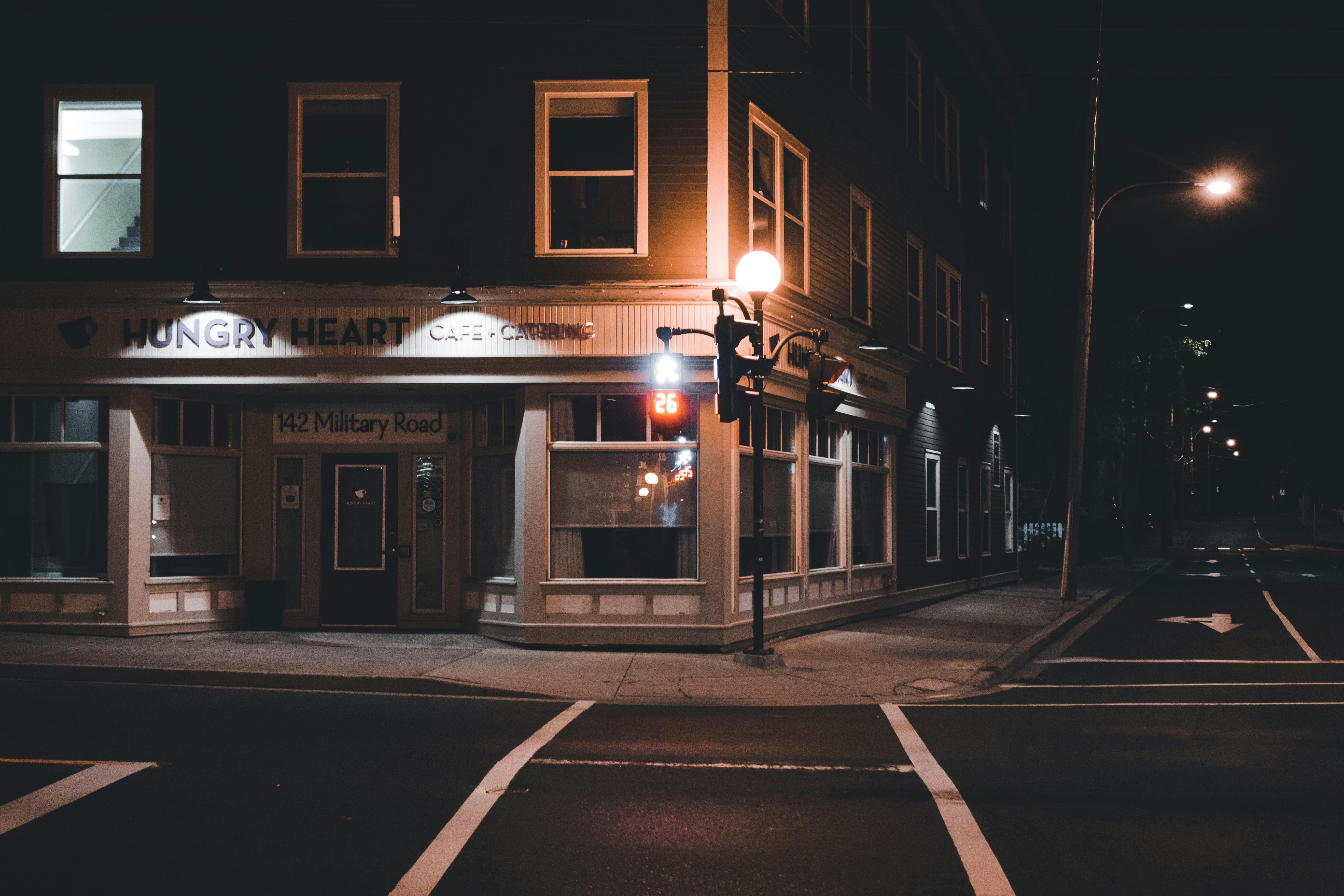 A Lamppost near a Building at Night · Free Stock Photo
