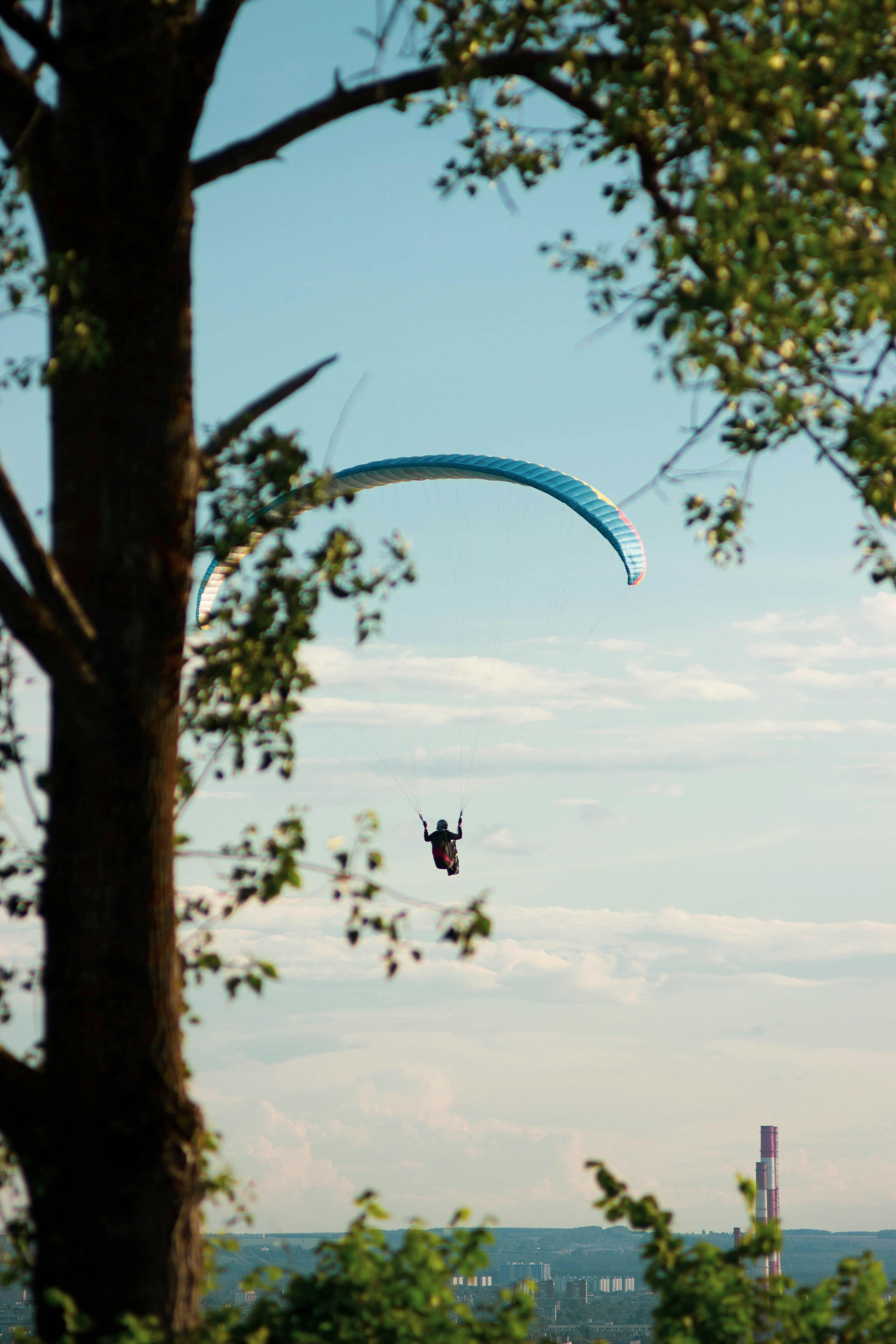 Person Riding Parachute · Free Stock Photo