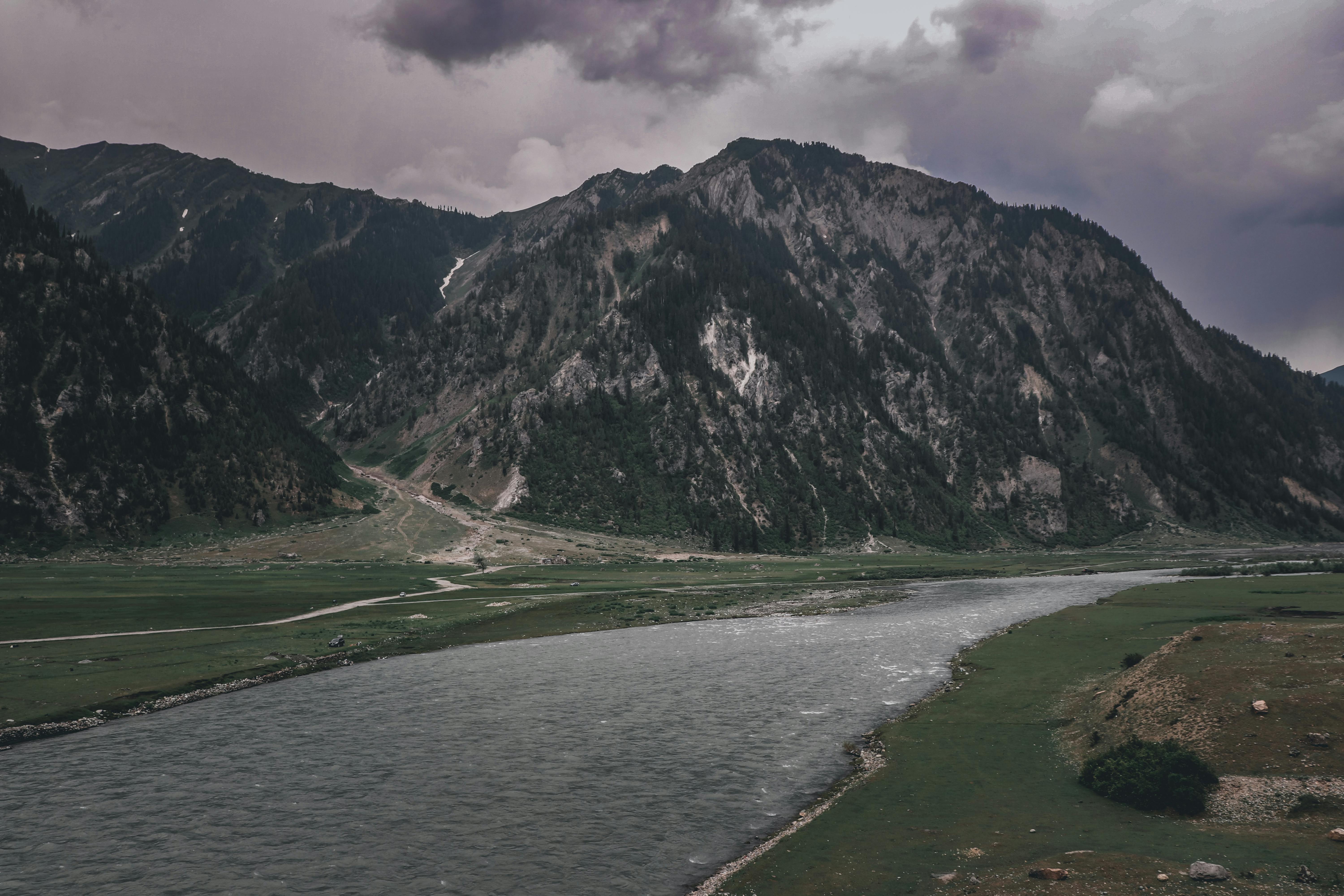 River in Between Mountains · Free Stock Photo