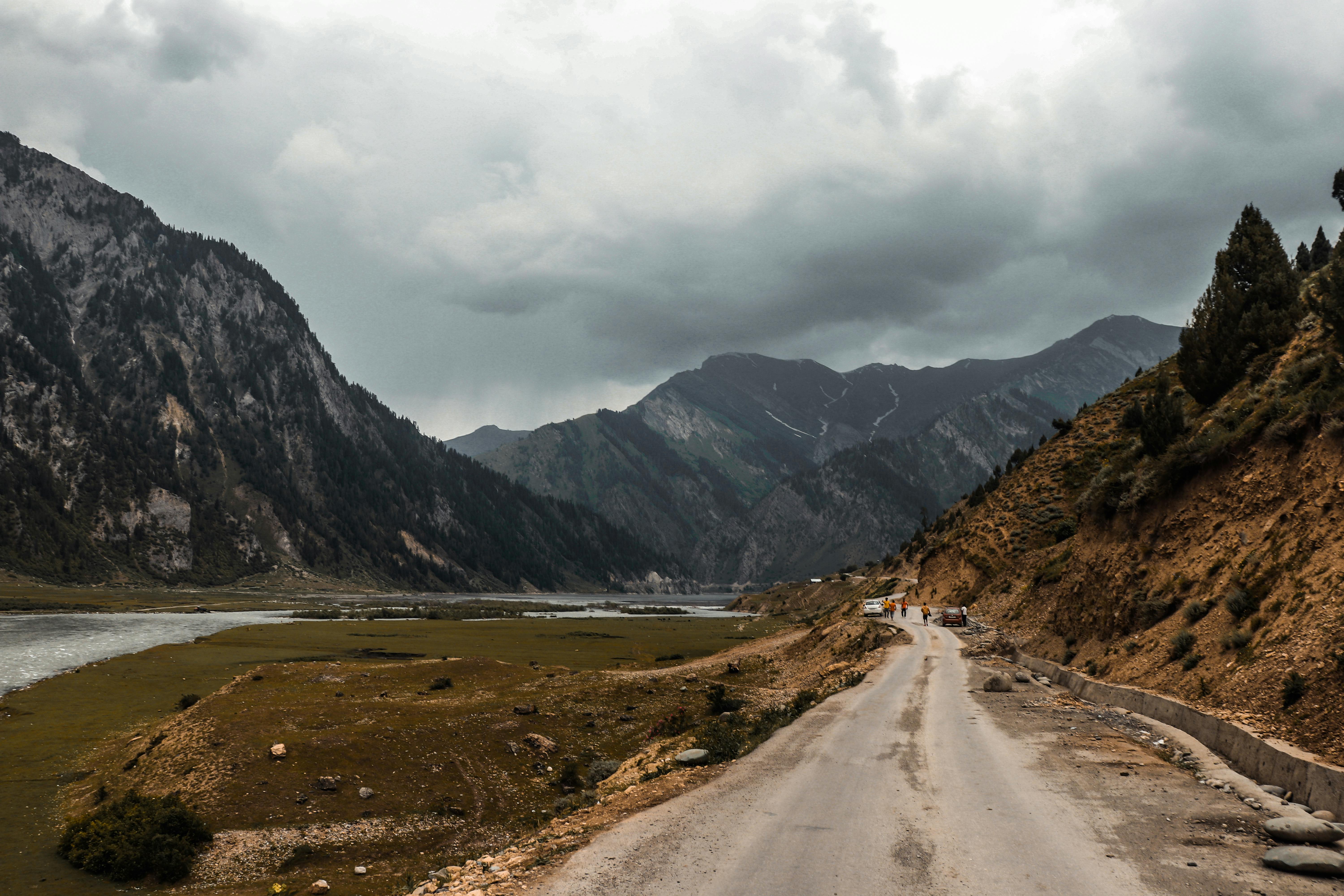 Valley between Mountains under Gloomy Sky · Free Stock Photo