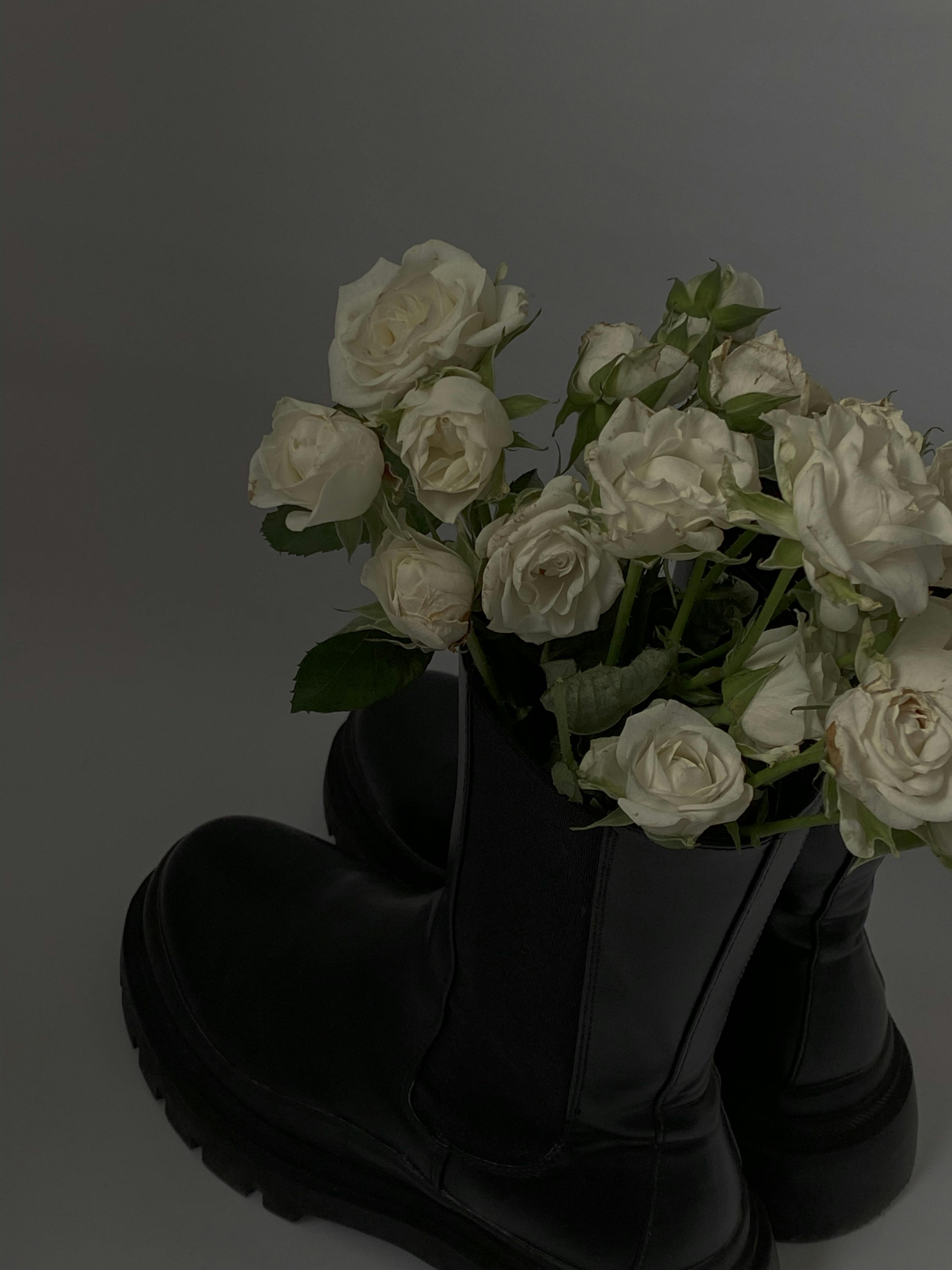 White Roses Bouquet on Black Leather Boots · Free Stock Photo