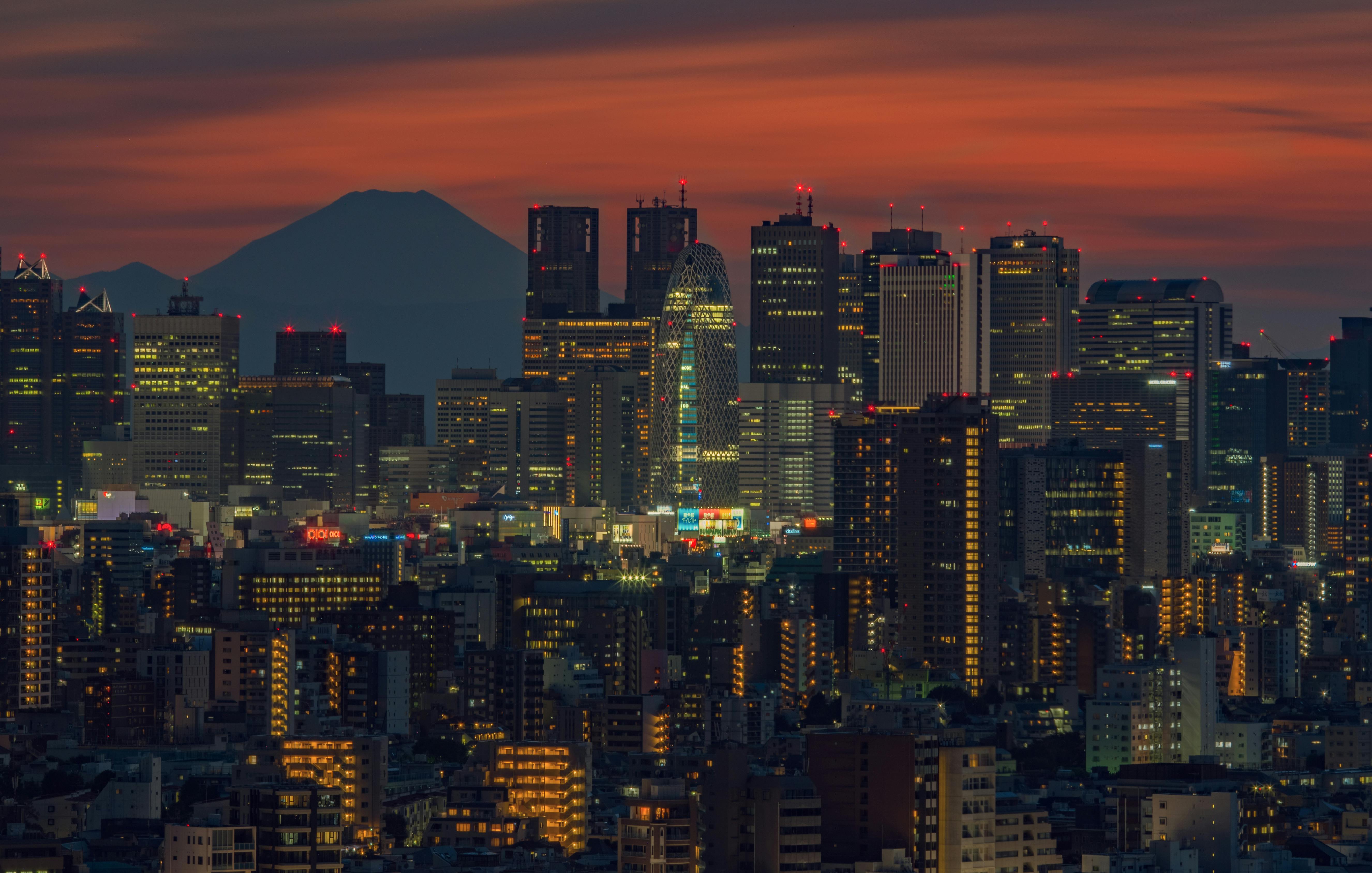 Skyscrapers and a Volcano at Dusk · Free Stock Photo