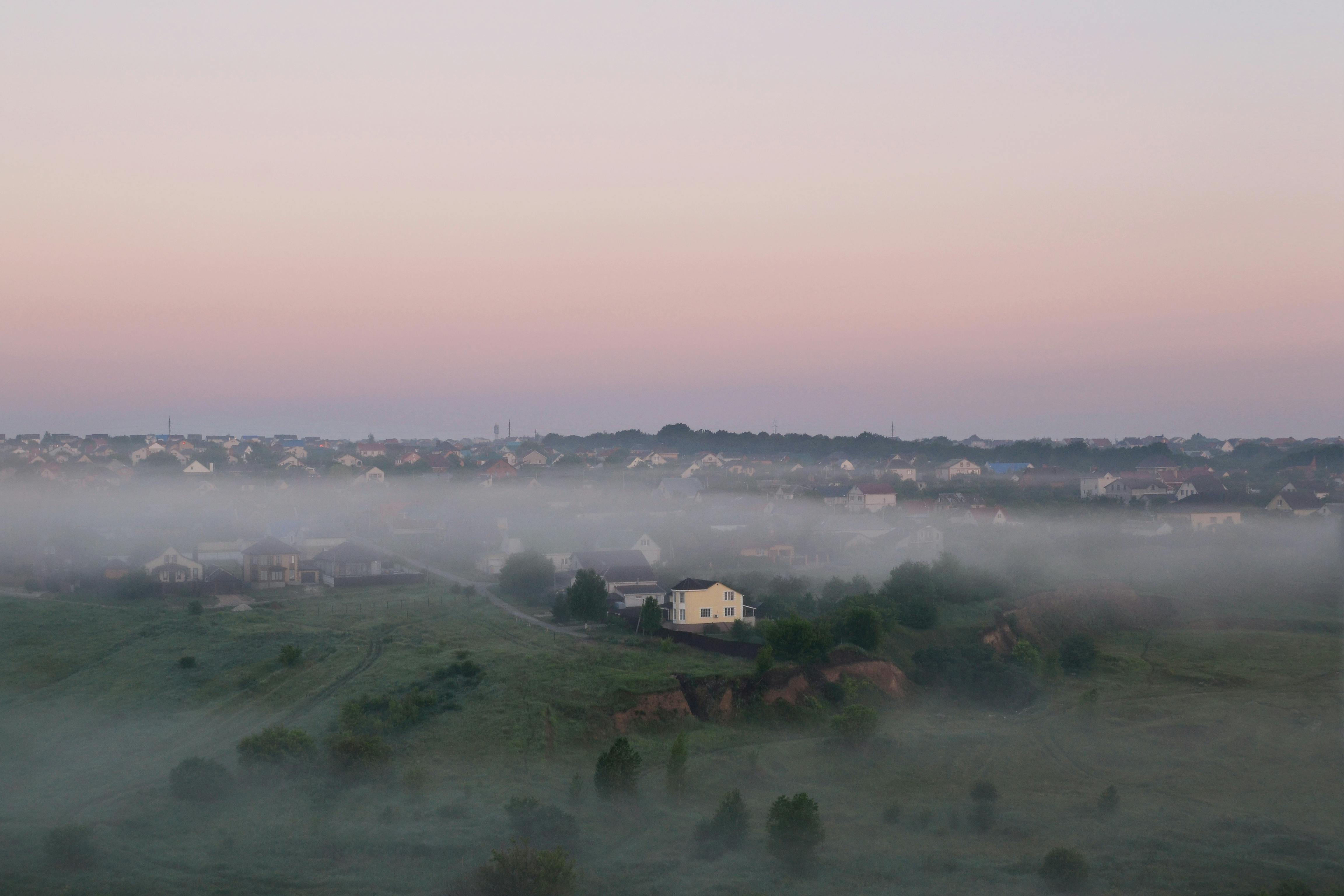 Aerial View of a Foggy Countryside · Free Stock Photo