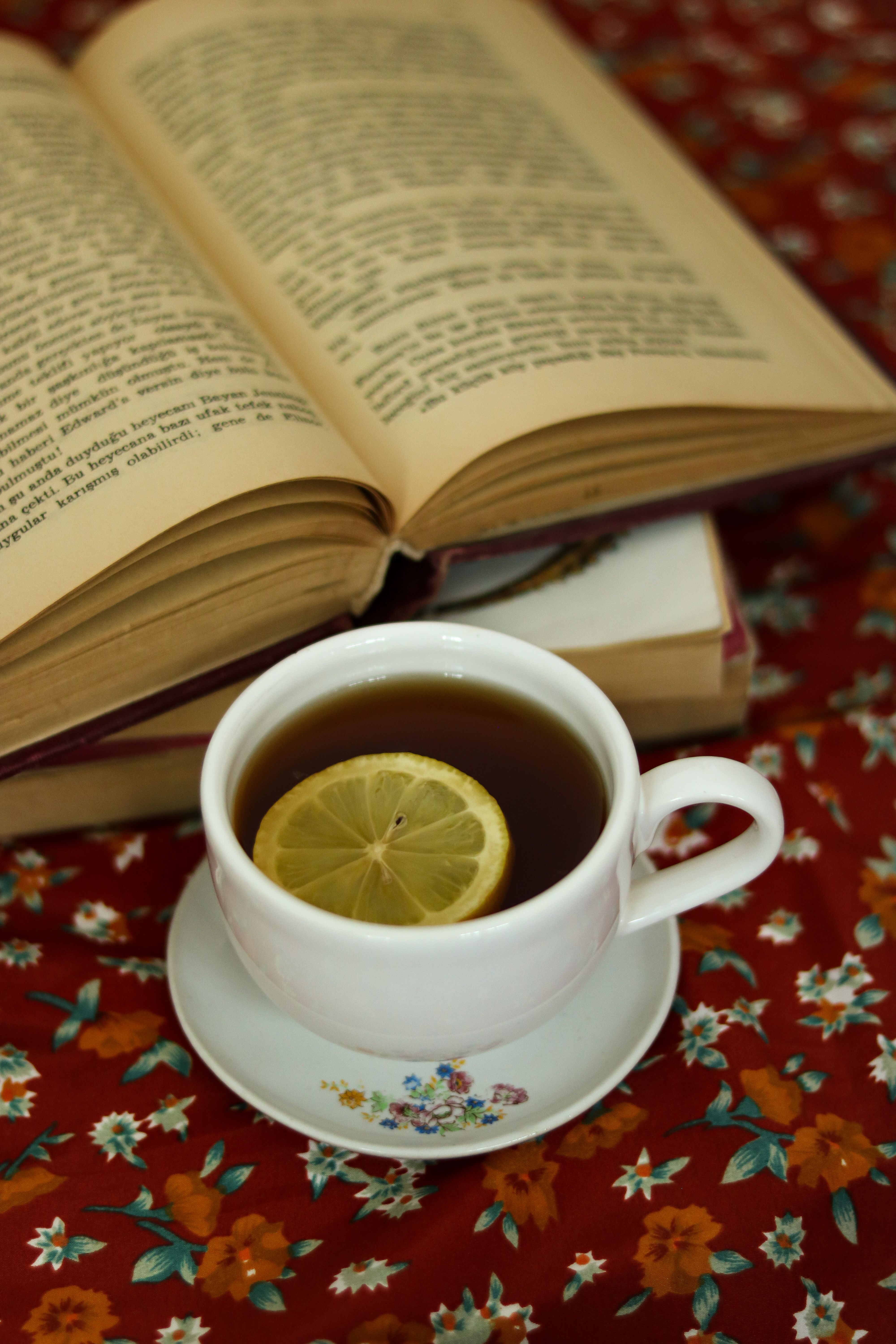 White Ceramic Cup Beside a Book · Free Stock Photo