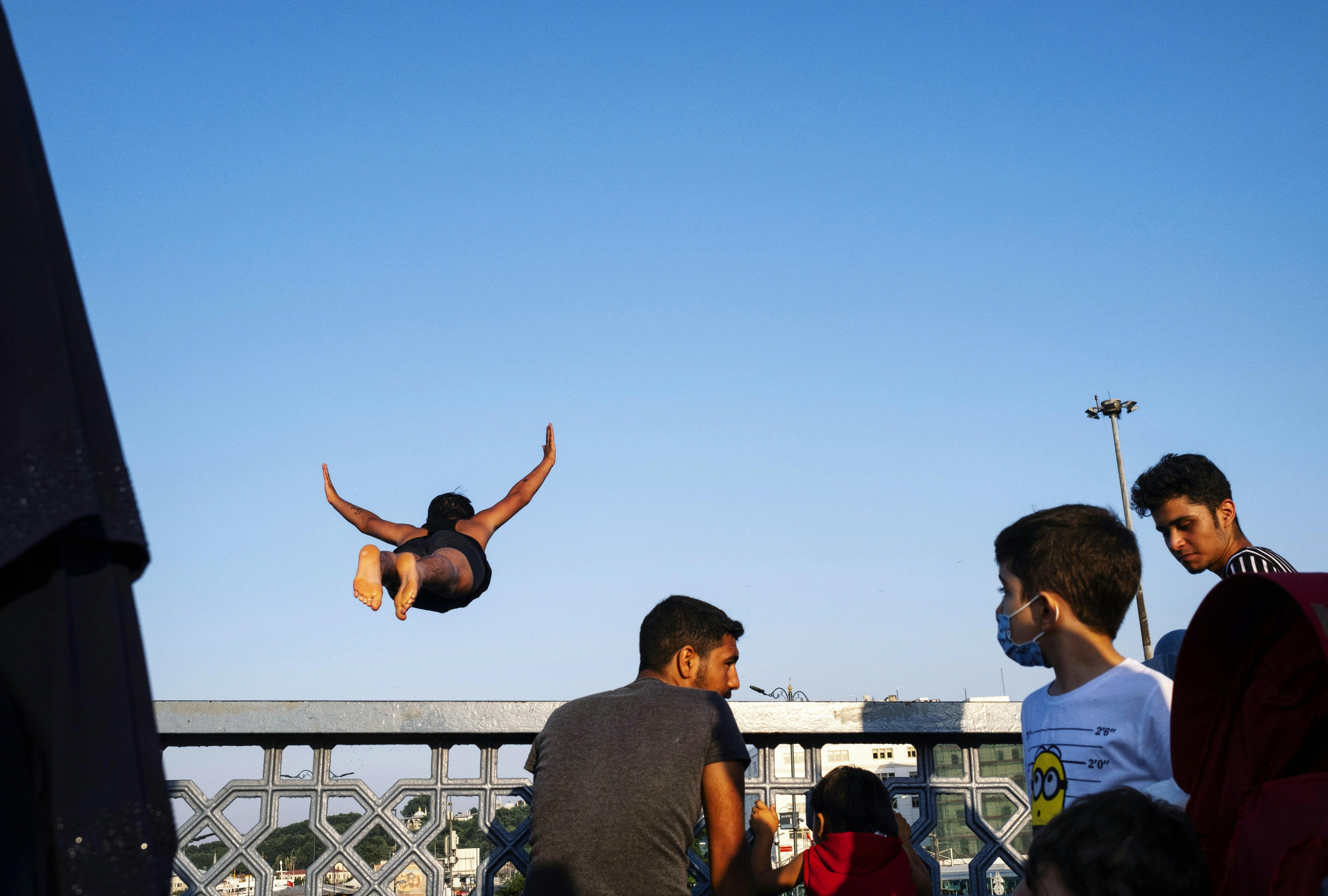 Woman Jumping from Railing · Free Stock Photo