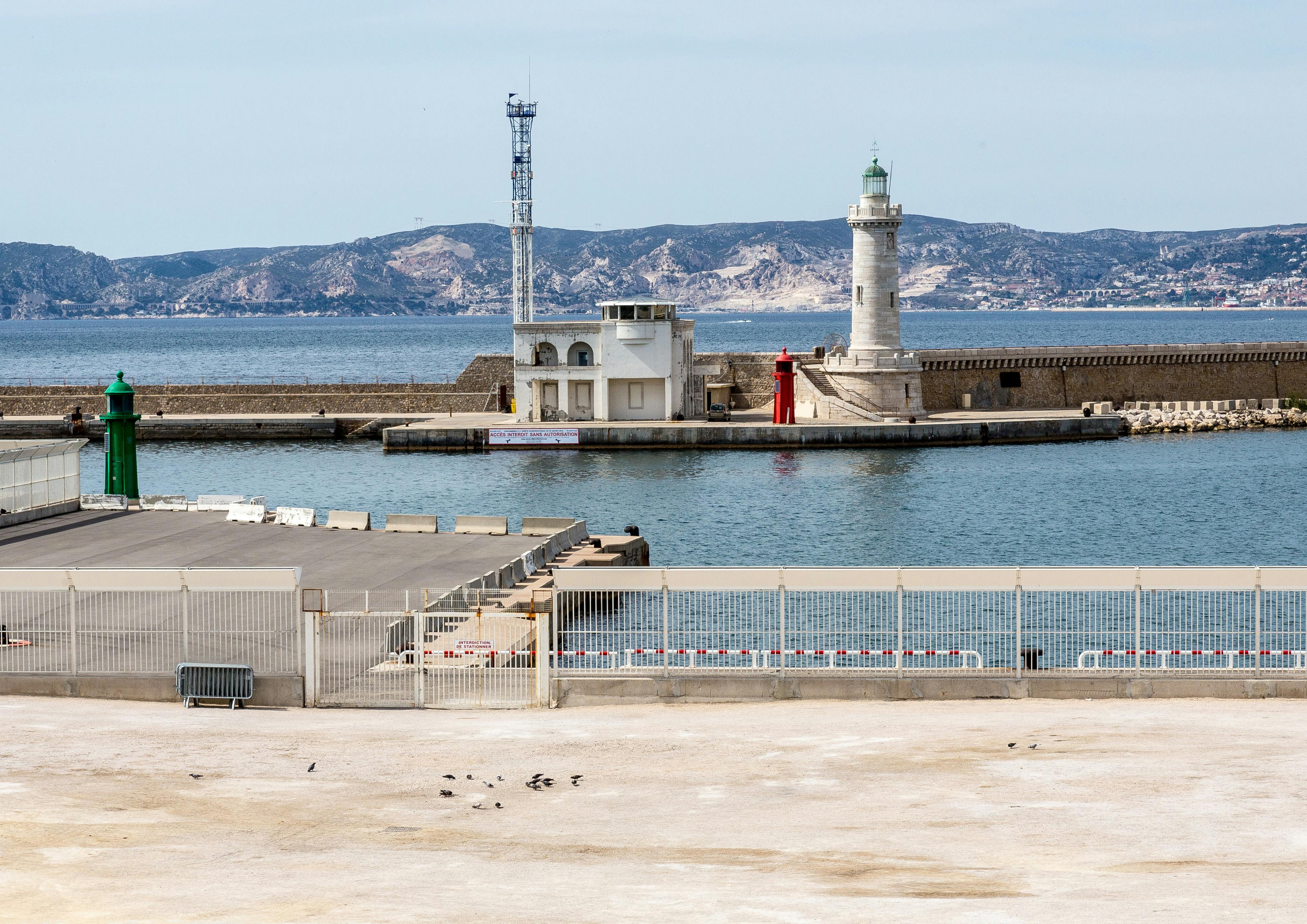 Landscape Photography of Lighthouse Near Body of Water · Free Stock Photo