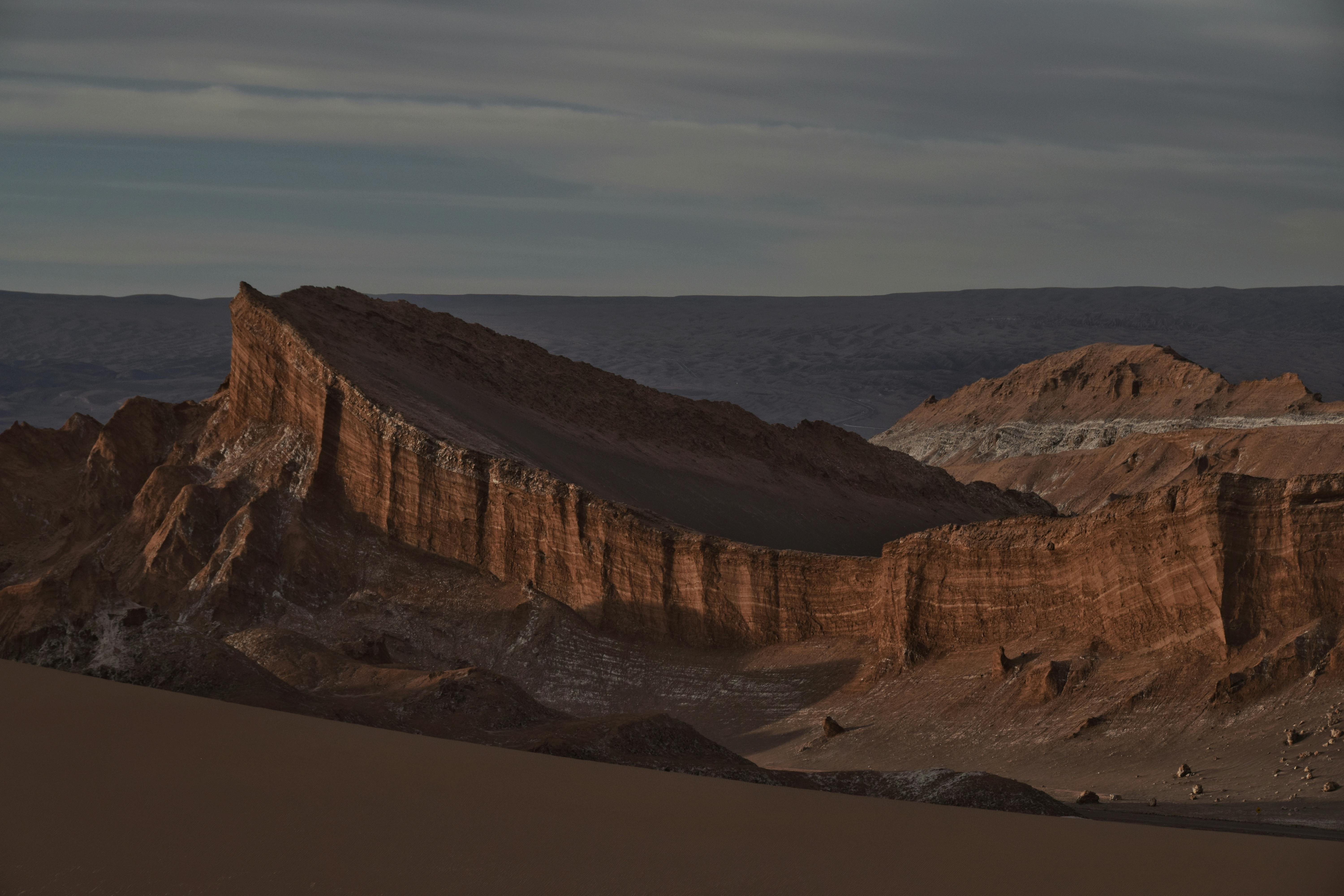 Brown Rock Formation on Gray Sand · Free Stock Photo