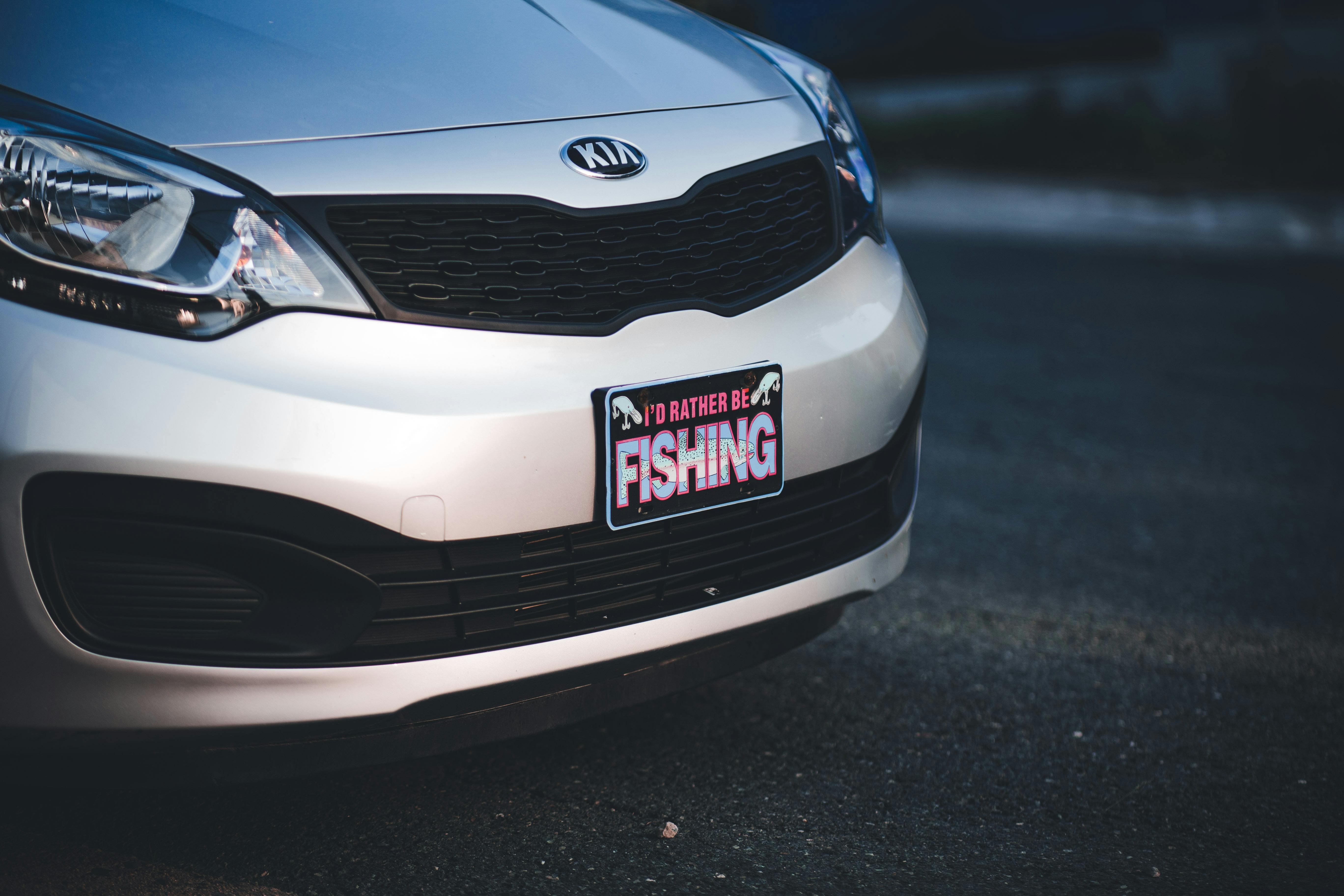 White Kia Rio Car on Road · Free Stock Photo