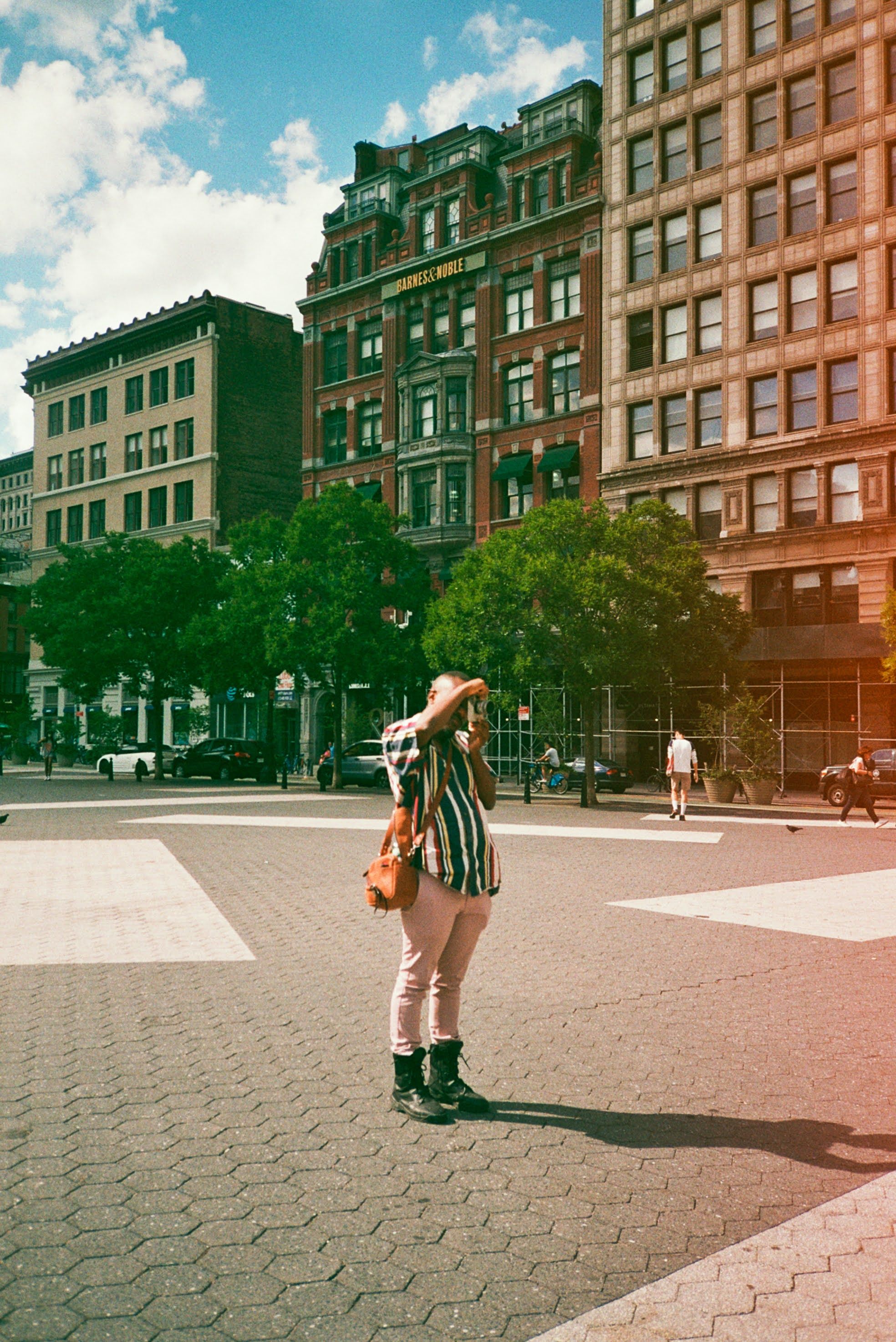 Man Standing on Square and Taking Pictures · Free Stock Photo