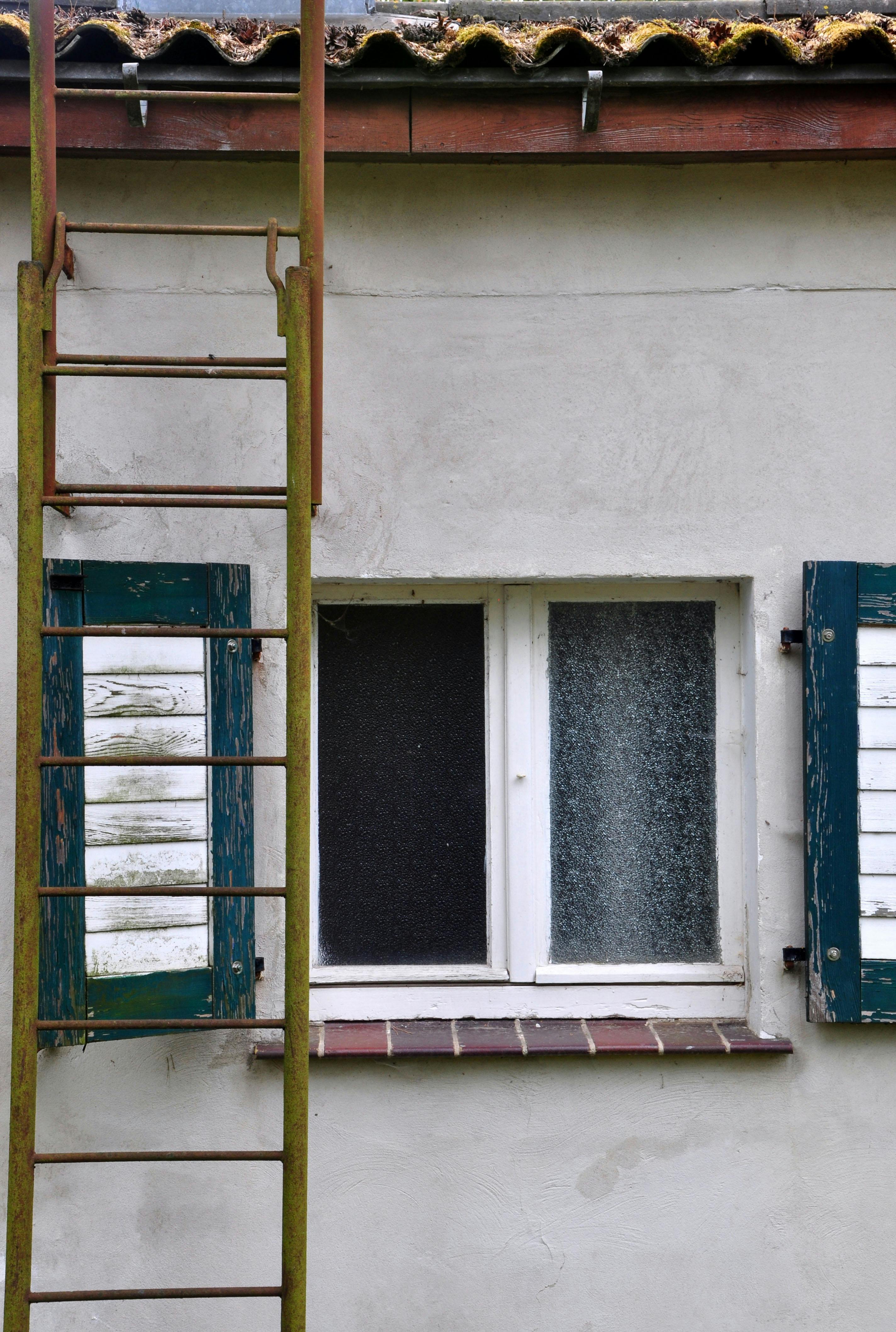 Ladder beside a Window · Free Stock Photo