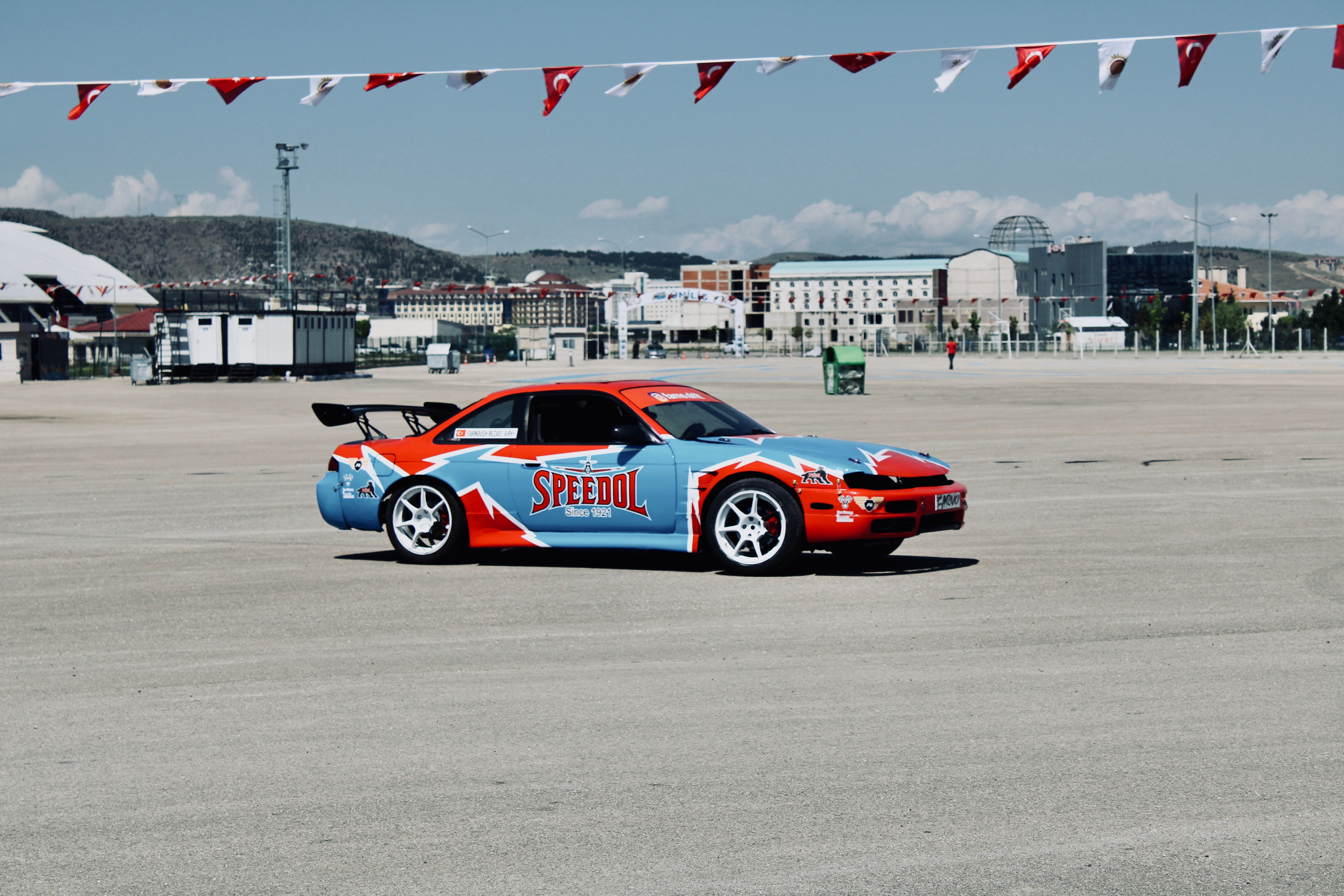 A Red Car on a Race Track · Free Stock Photo