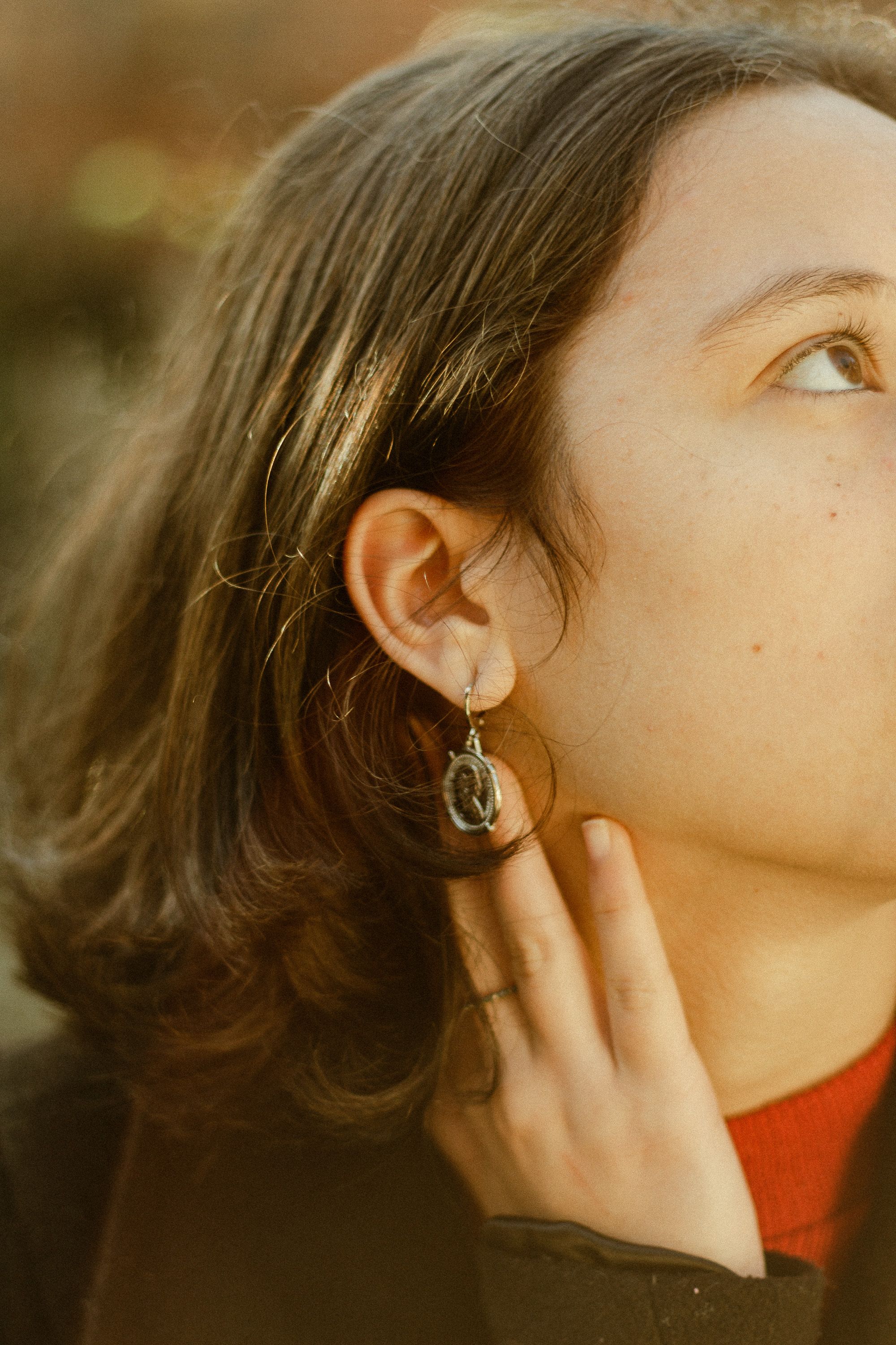 Side View of a Woman Wearing Diamond Earring · Free Stock Photo