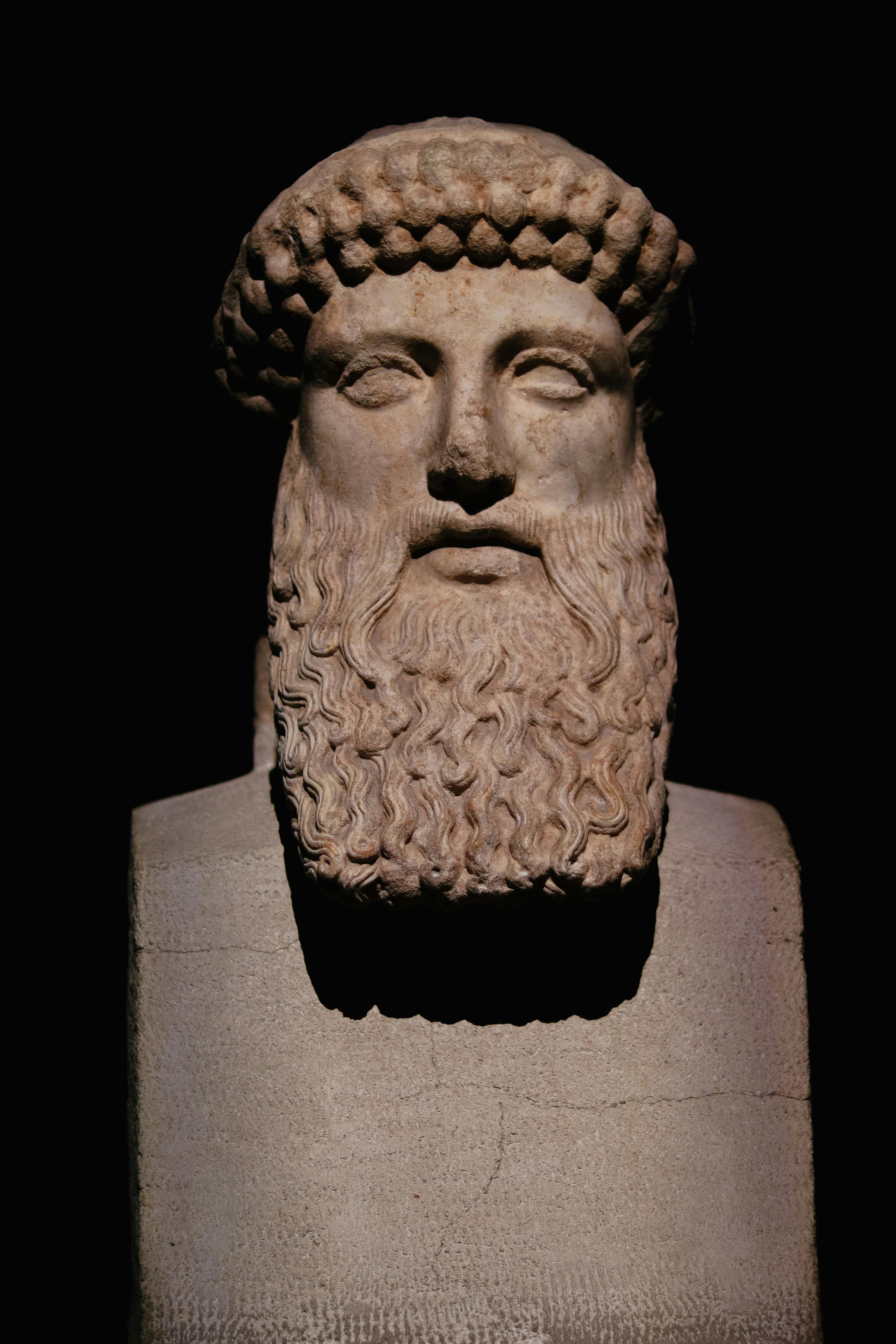 Statue of a Head Surrounded with Plants · Free Stock Photo