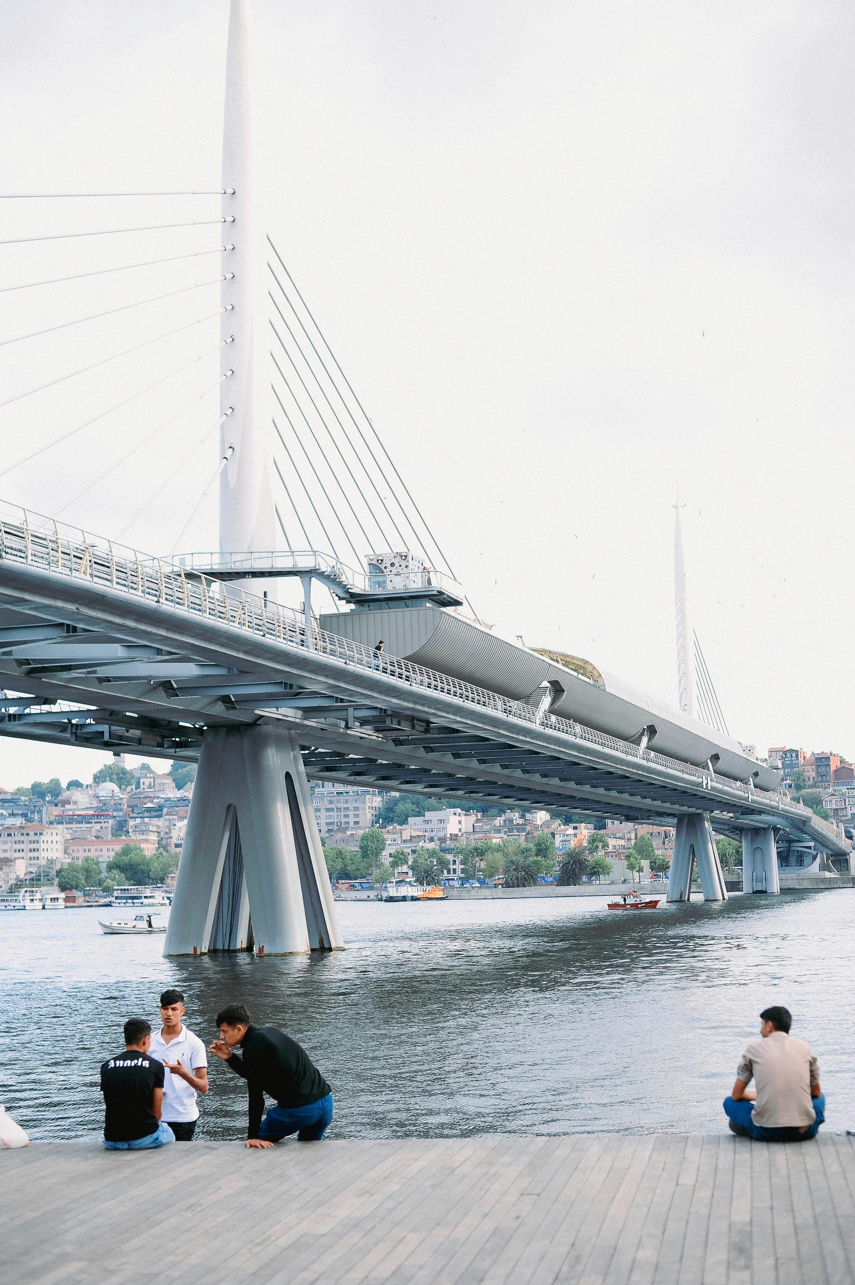 People Sitting by the Golden Horn Bridge, Istanbul, Turkey · Free Stock ...
