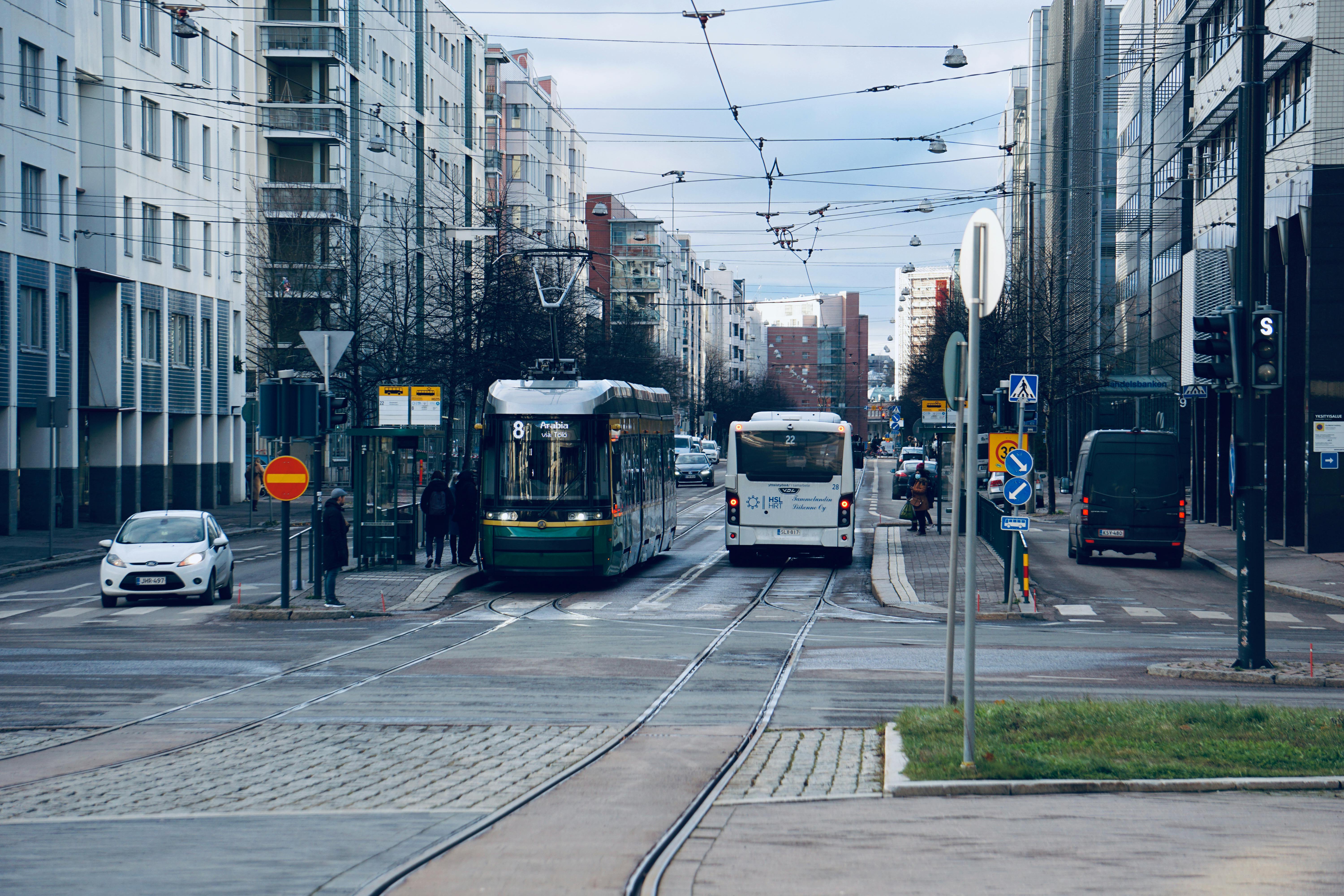 Tram and a Bus on the Street · Free Stock Photo